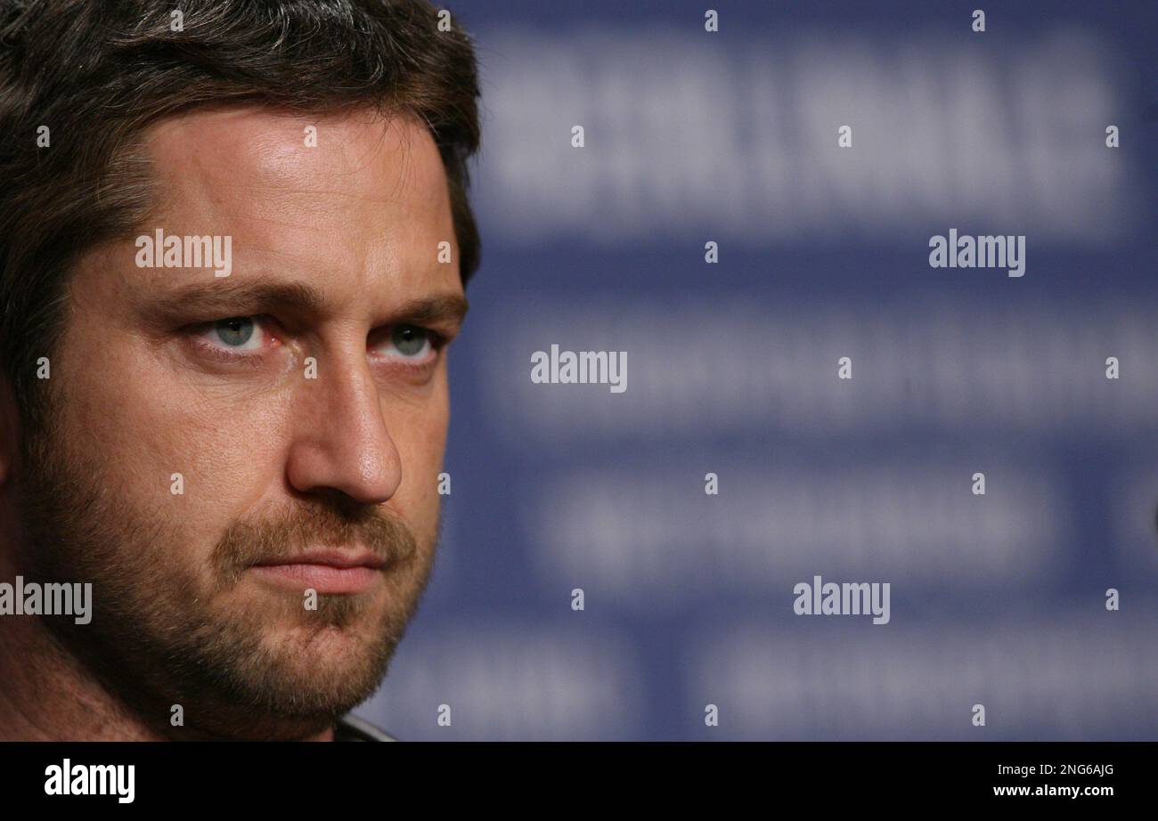 British actor Gerard Butler poses on a photo call to the film "300" at ...