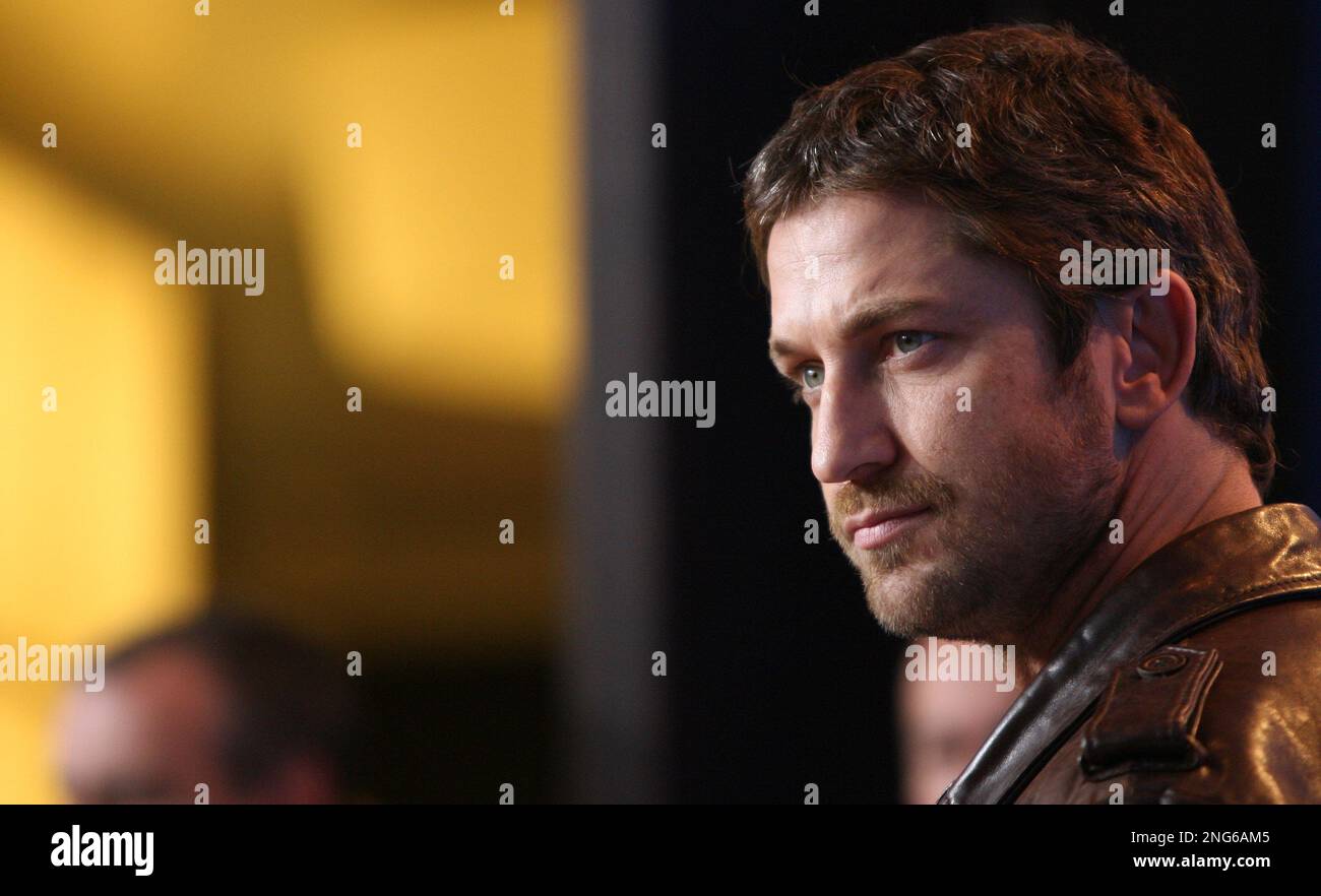 British actor Gerard Butler poses on a photo call to the film "300" at ...