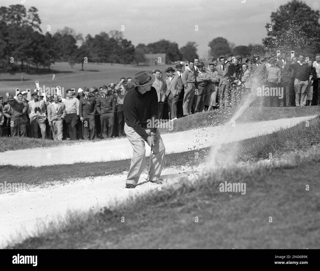 Sam Snead hits the ball from a sand trap on the seventh hole in the ...