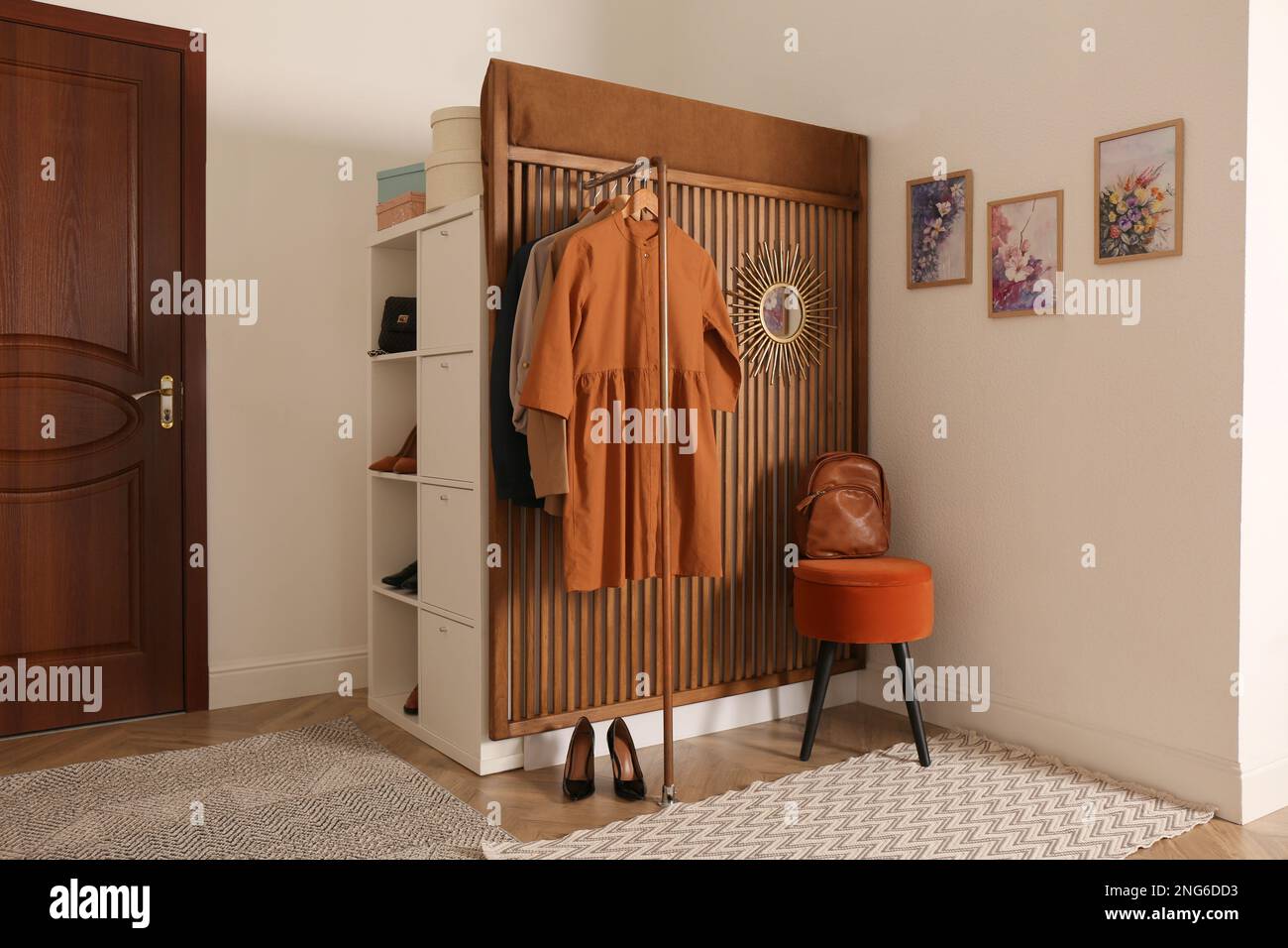 Modern hallway interior with stylish furniture and clothes rack Stock ...