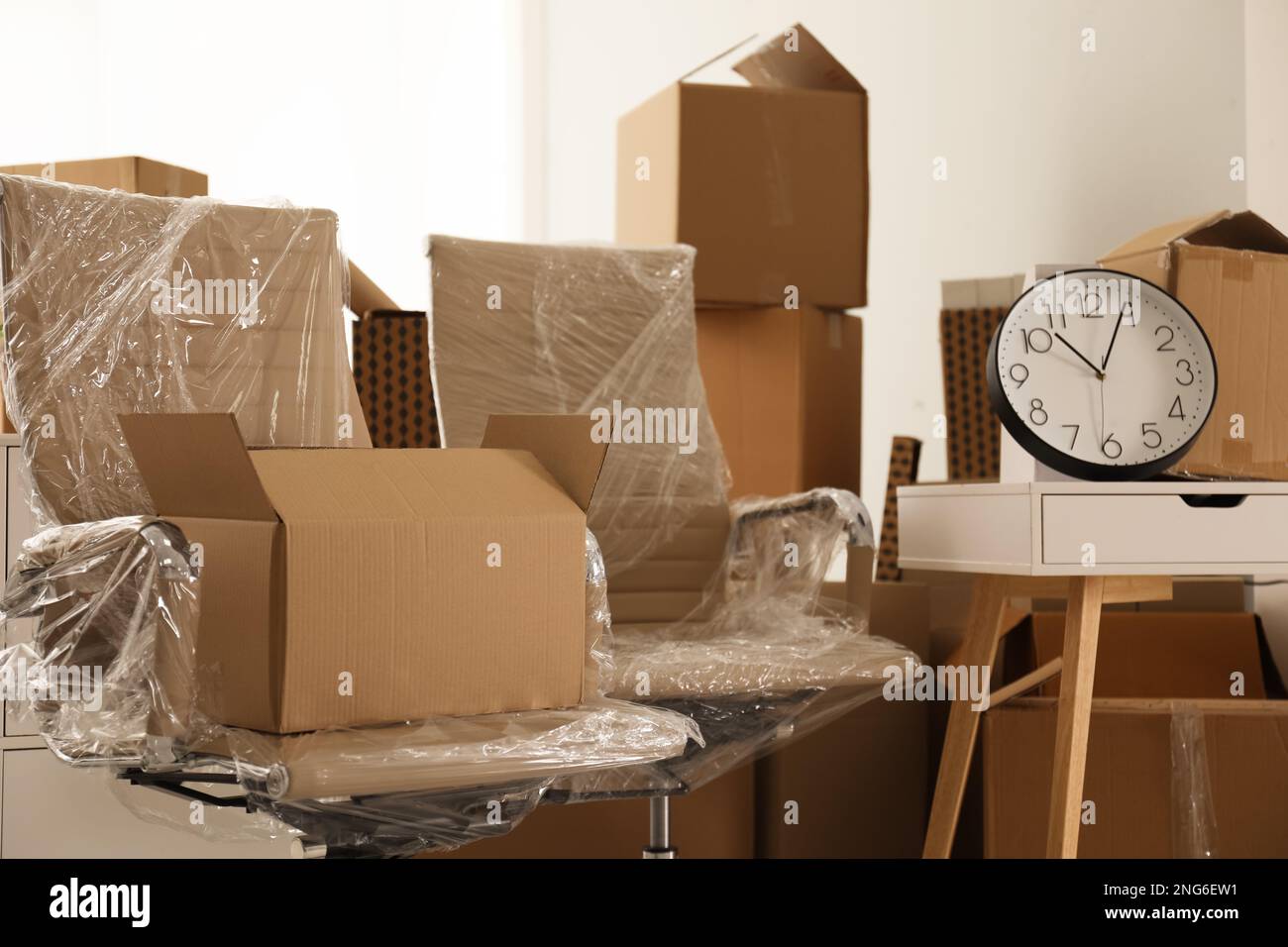 Packed stuff and cardboard boxes in office. Moving day Stock Photo - Alamy