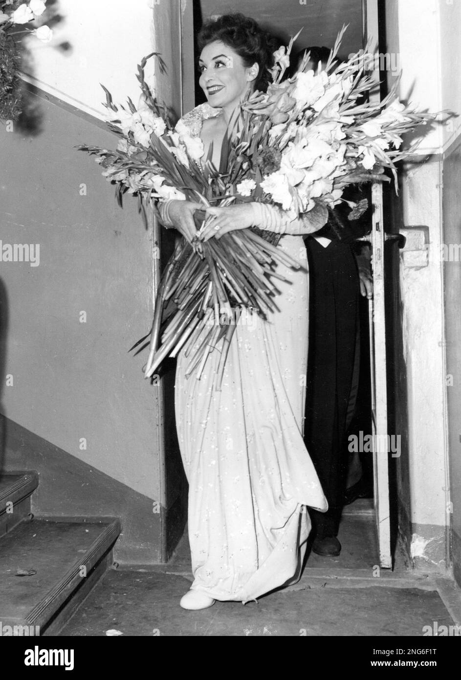 Famous Swedish actress and singer Zarah Leander holds flowers she ...