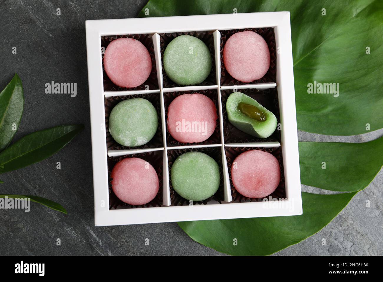 Box with different delicious mochi on grey table, top view Stock Photo ...