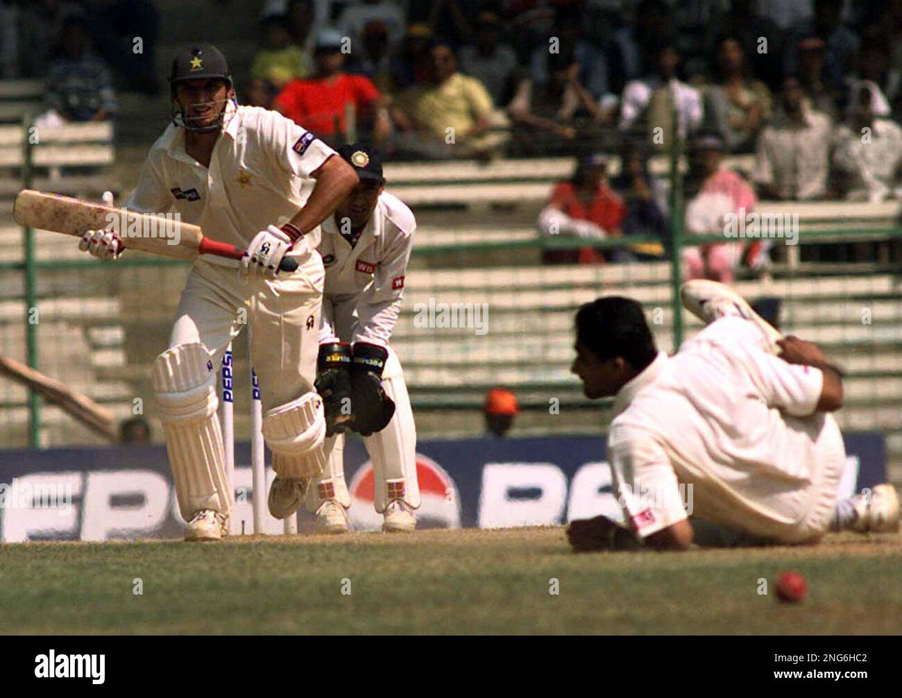 Indian spinner Anil Kumble is unable to stop a shot from Pakistan ...