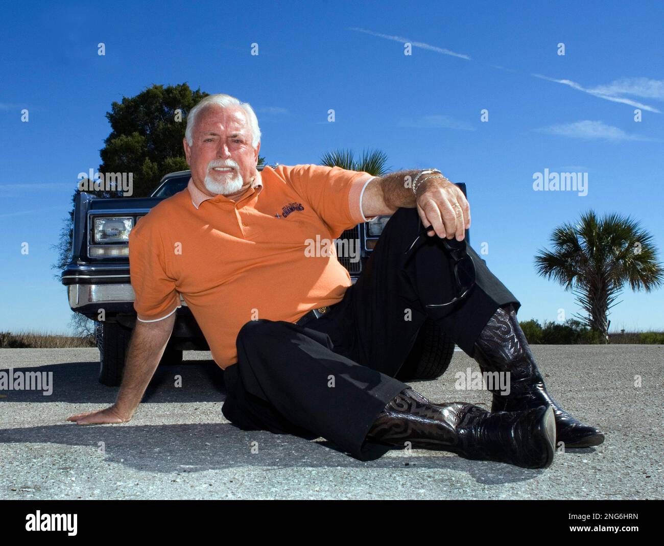 Jack Roland Murphy, better known as "Murph the Surf," sits in front of ...