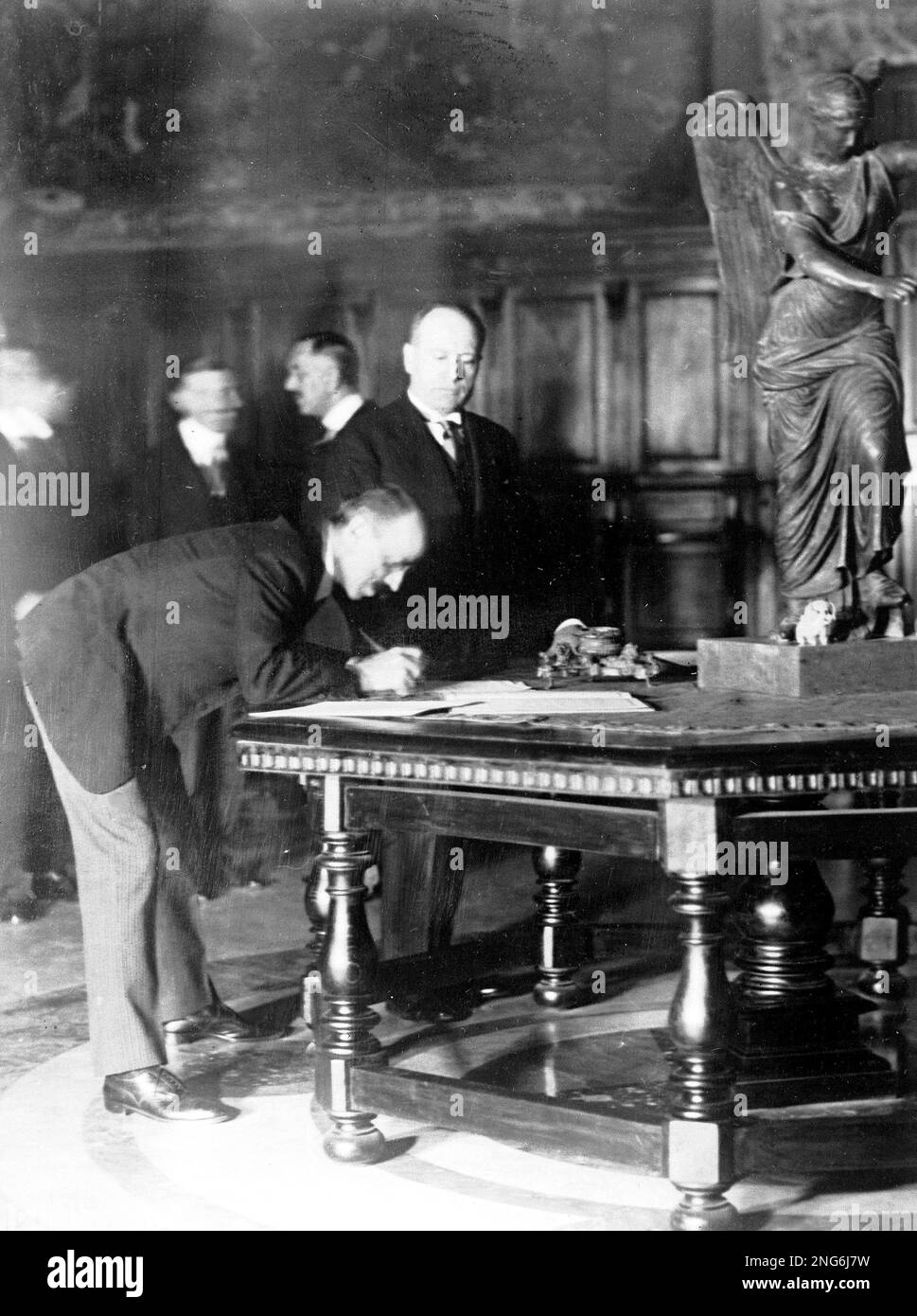 Hungarian Prime Minister Count Stephen Bethlen, foreground, signs the ...
