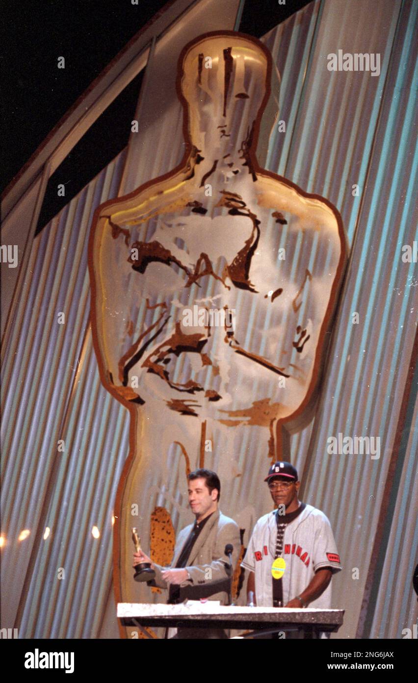 Best actor nominee for his role in "Pulp Fiction," John Travolta, left ...