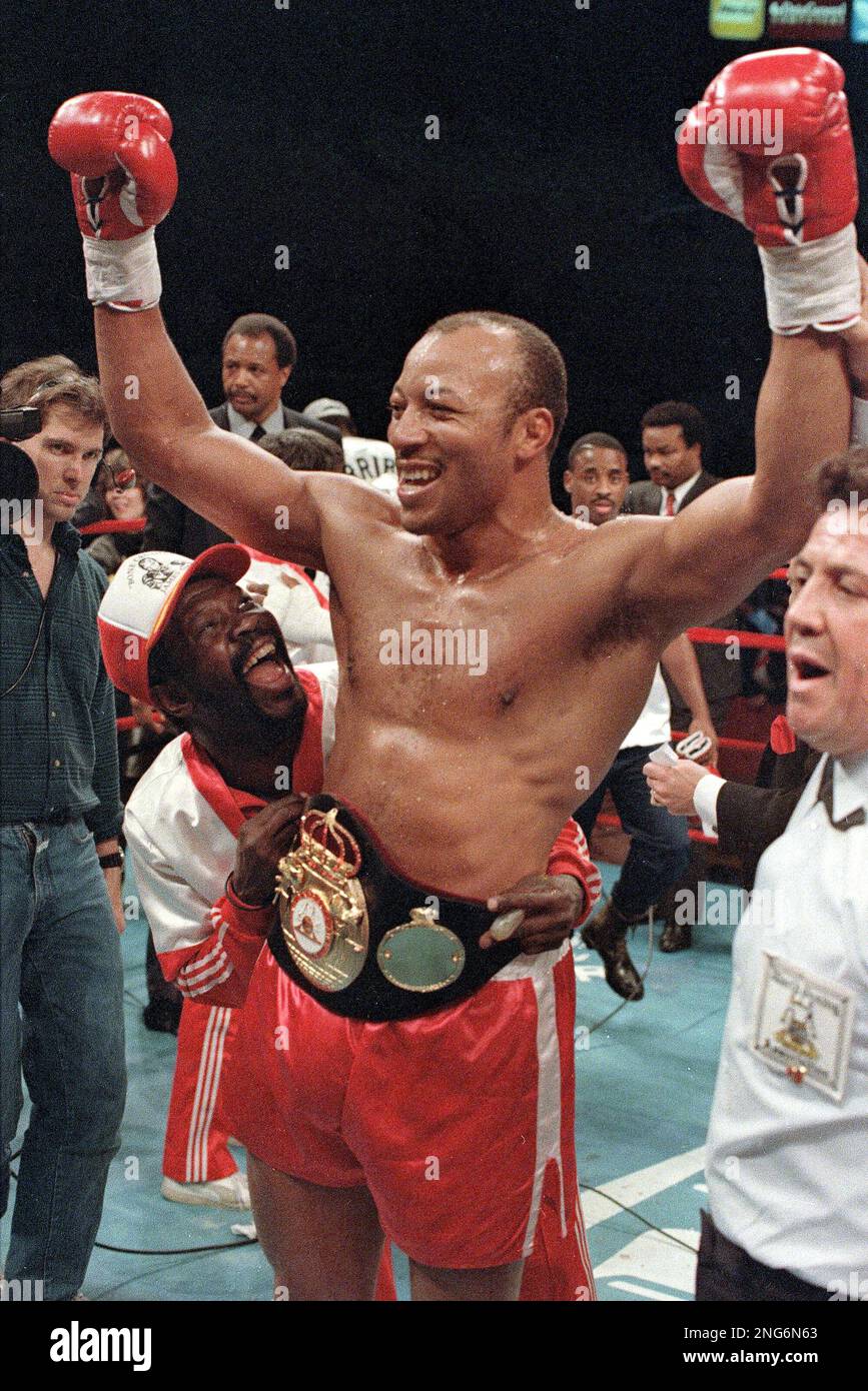 James "Bonecrusher" Smith raises his arms in victory after knocking out ...
