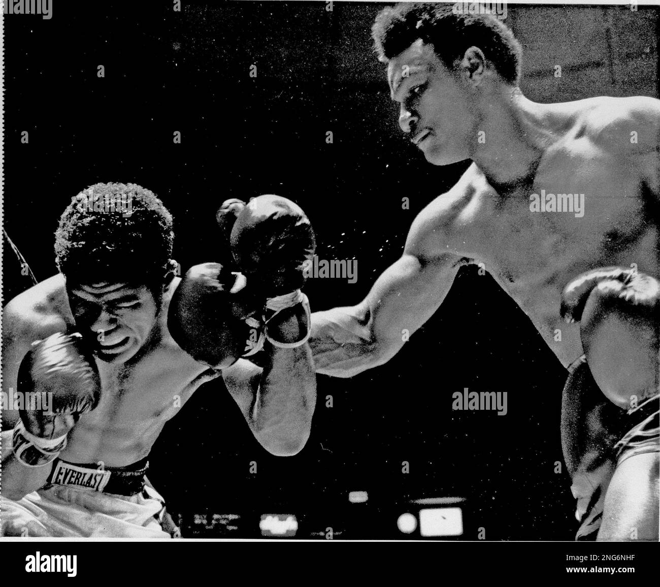 George Foreman, right, unbeaten Olympic heavyweight boxing champ ...