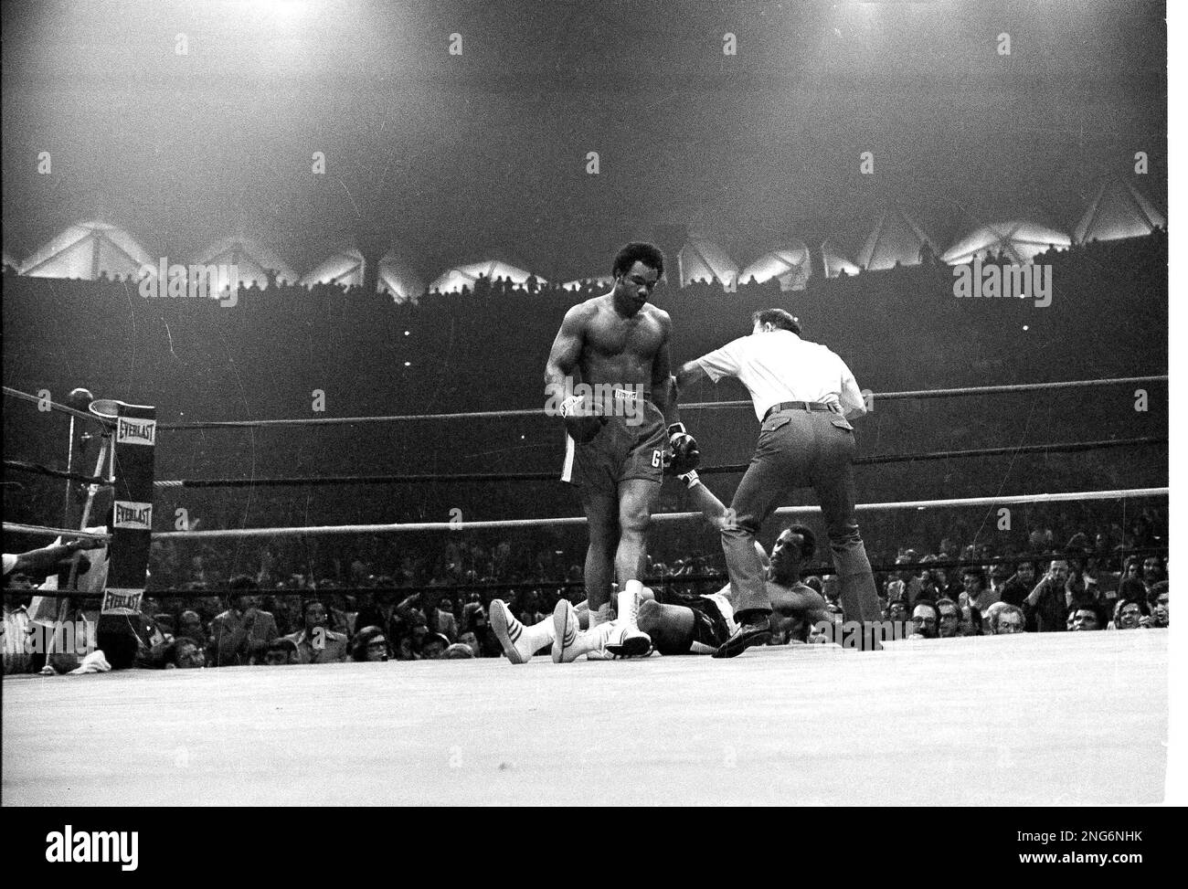 Referee Jim Rondeau sends George Foreman to a neutral corner after the ...