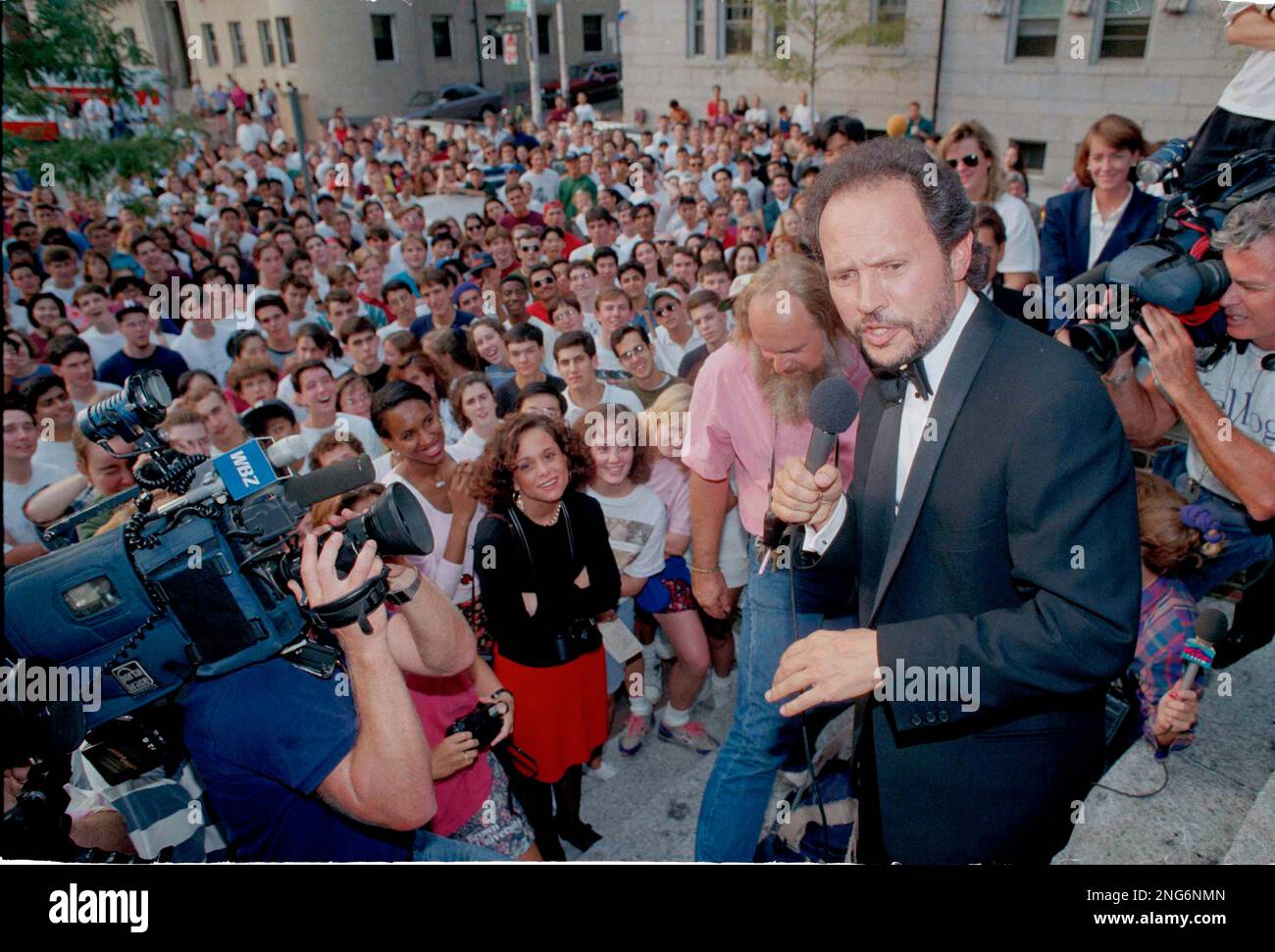 A large crowd fills a downtown Cambridge, Mass., street to see and hear ...