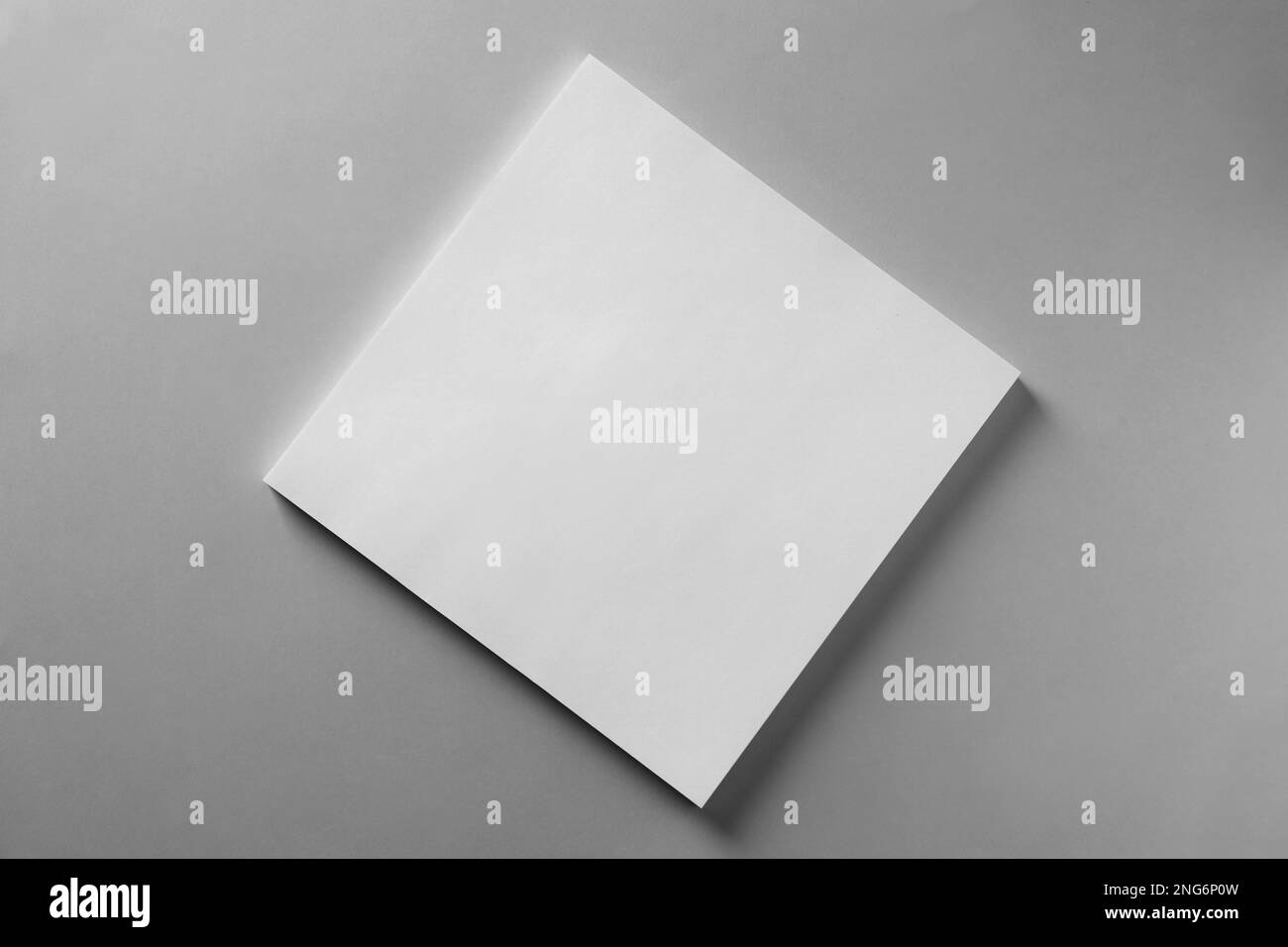 Stack of blank paper sheets for brochure on light grey background, top ...