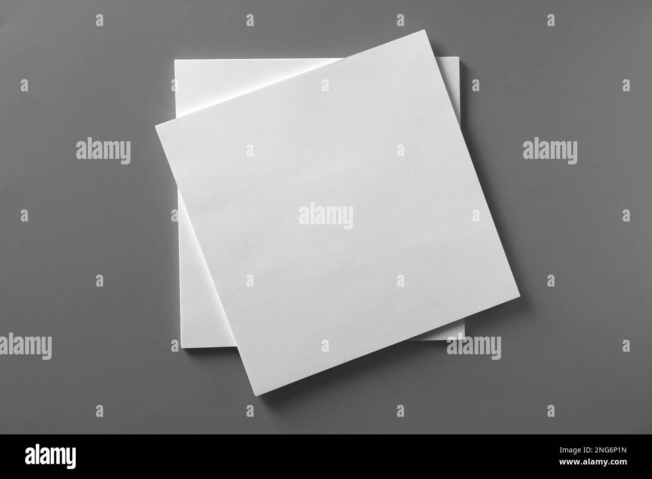 Stack of blank paper sheets for brochure on light grey background, top ...