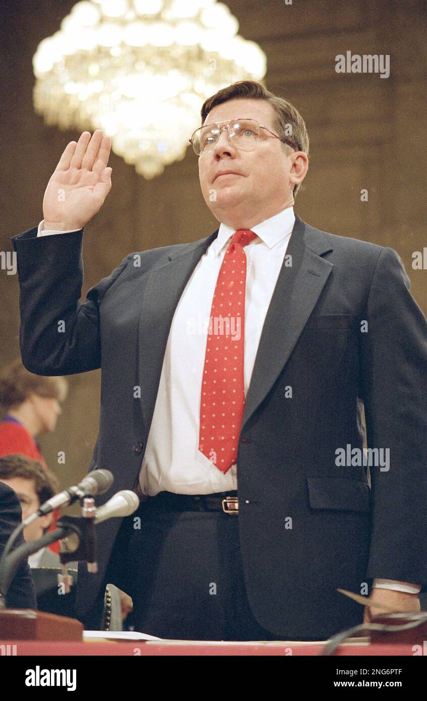 Former Maj. Gen. Richard Secord is sworn in by the panel holding the ...