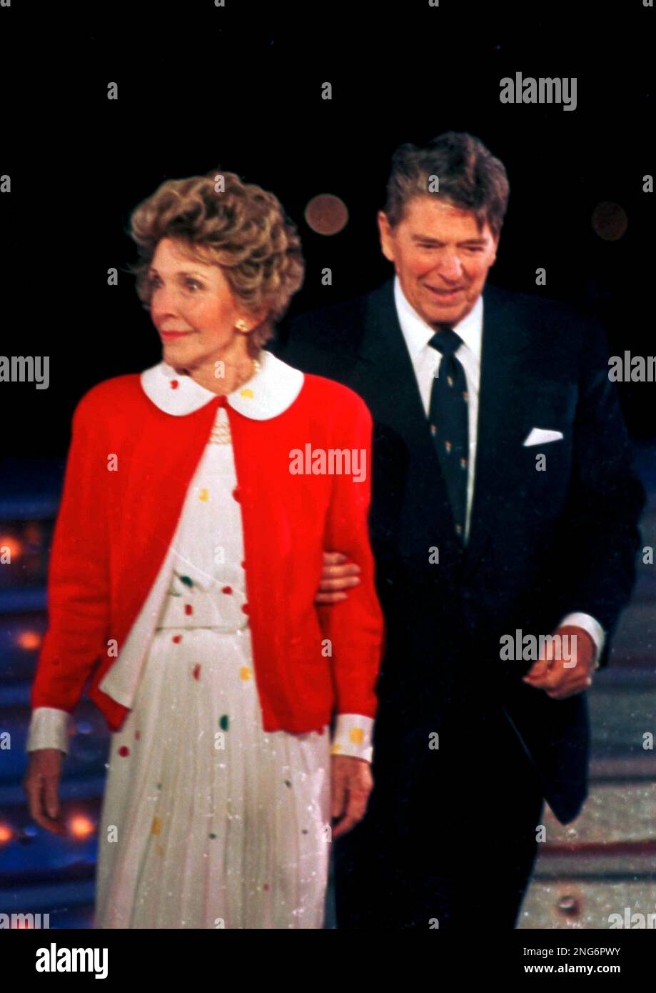 President Ronald Reagan, seen with first lady Nancy Reagan, smiles ...