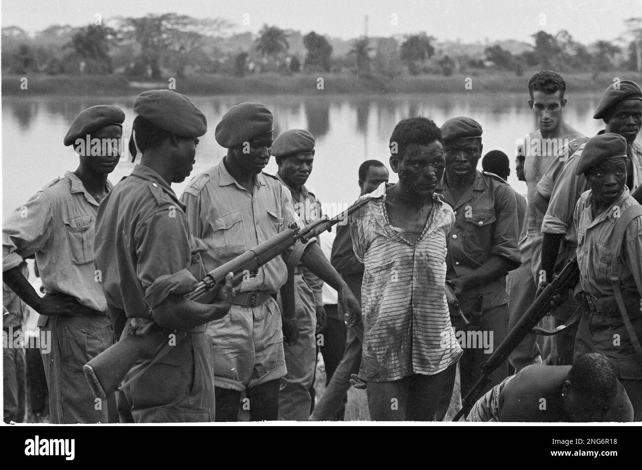 A Congolese rebel army leader is hauled off by government soldiers ...