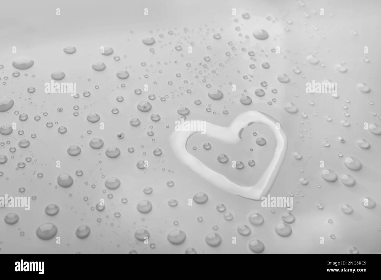 Heart shape of water and drops on light background Stock Photo - Alamy