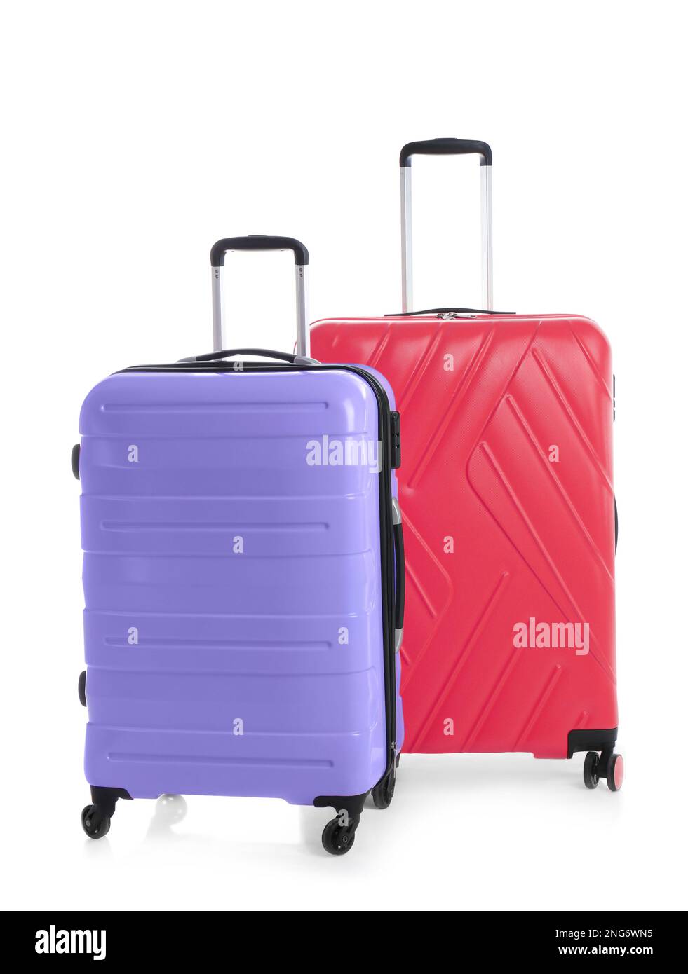 Modern suitcases for travelling on white background Stock Photo - Alamy