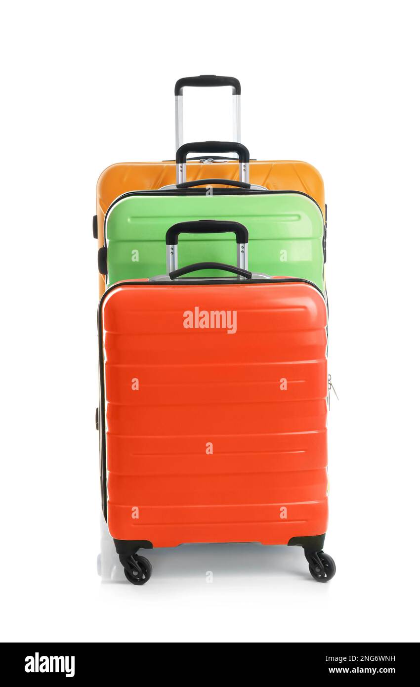 Modern suitcases for travelling on white background Stock Photo - Alamy
