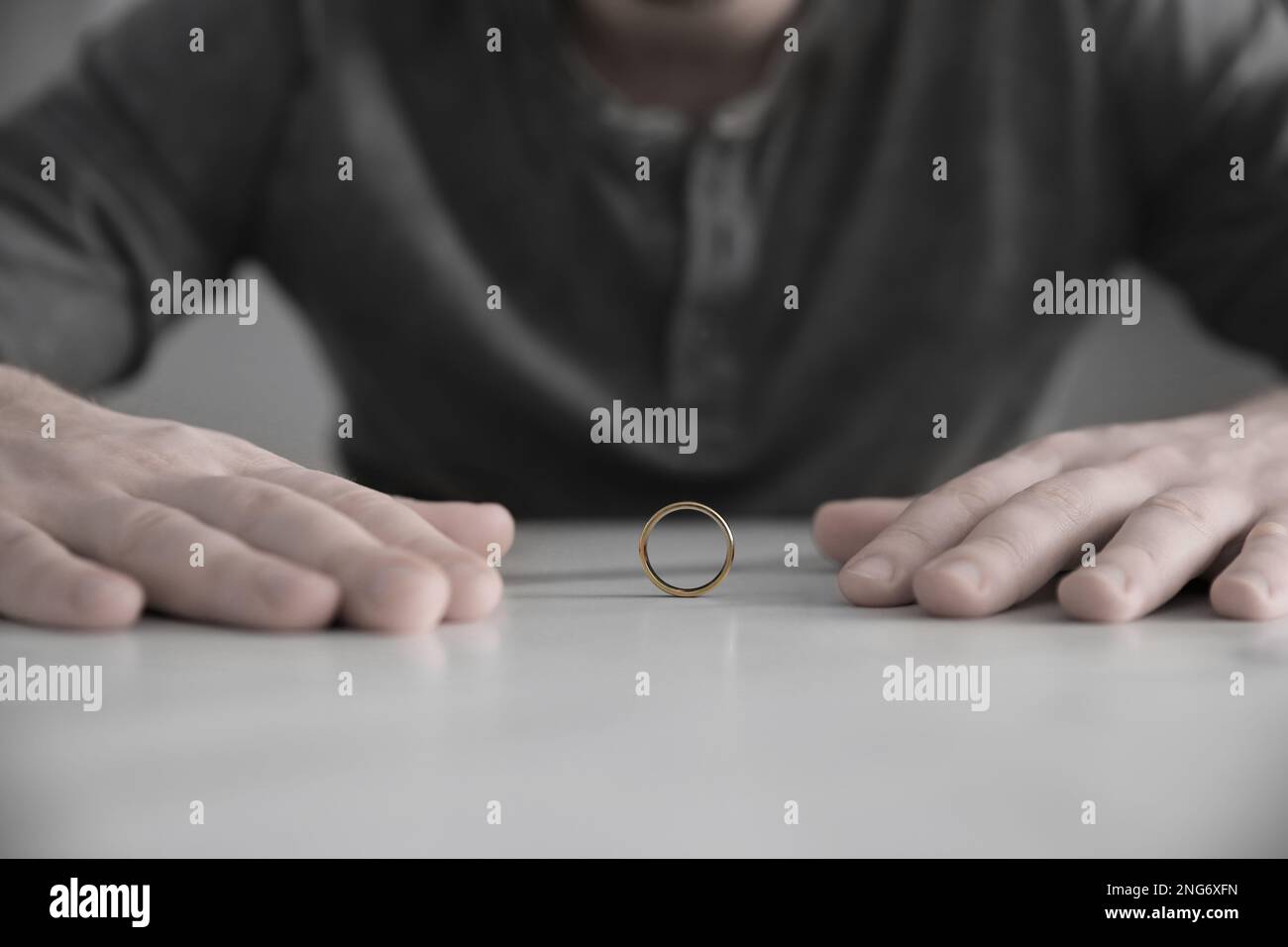 Man with wedding ring at table, closeup. Cheating and breakup Stock ...