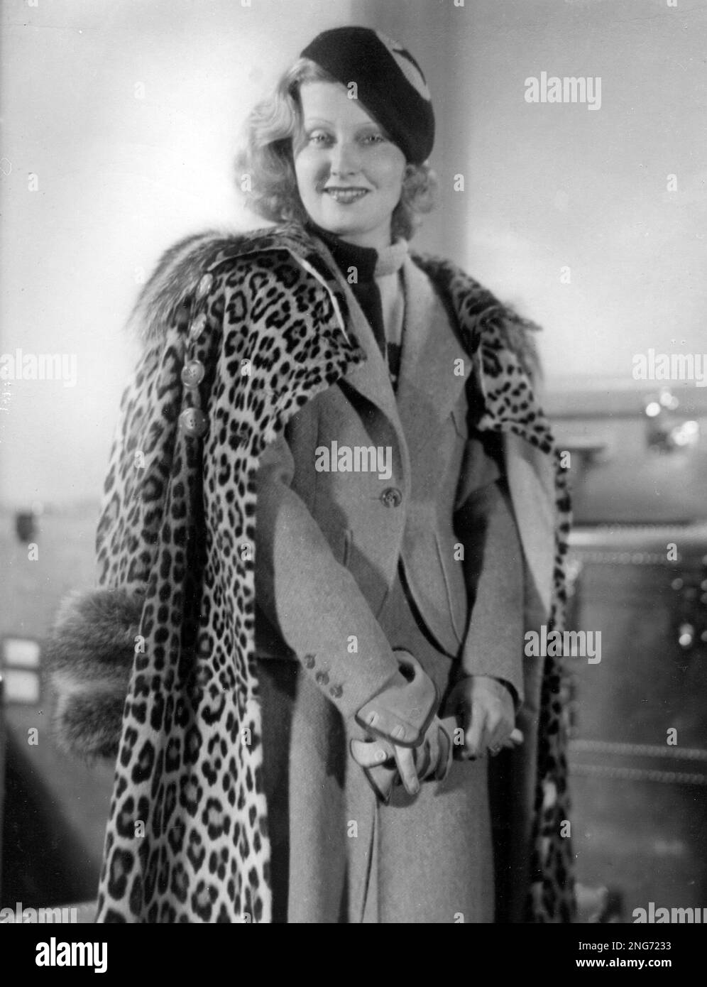 German actress Lilian Harvey presents fashion by Joe Strassner wearing ...