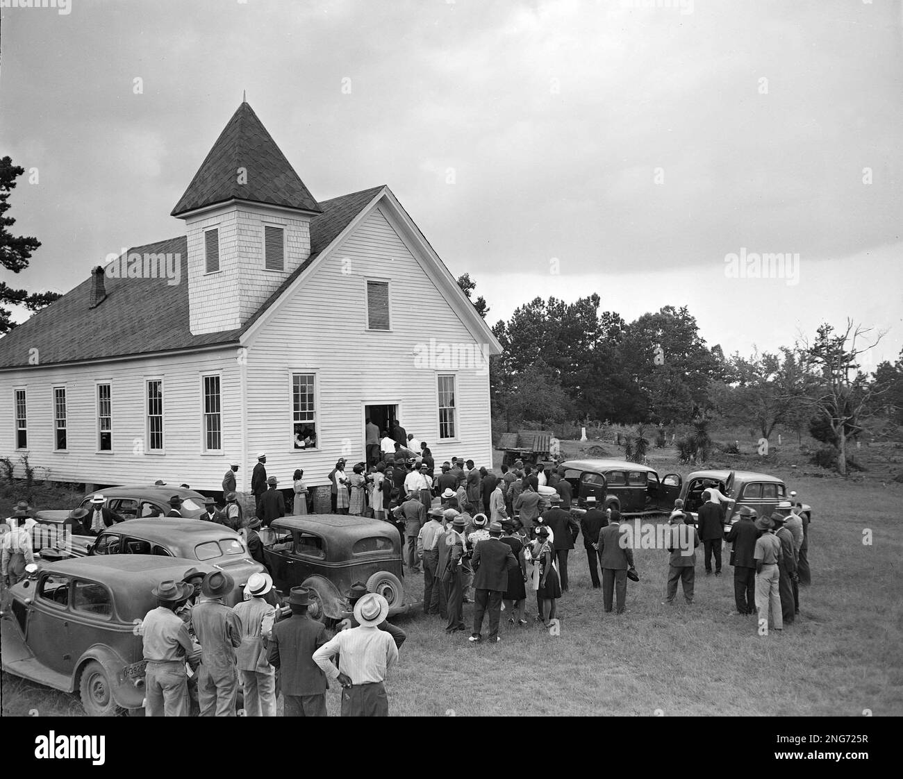 A crowd gathers at the Mt. Perry church near Monroe, Ga., for funeral ...