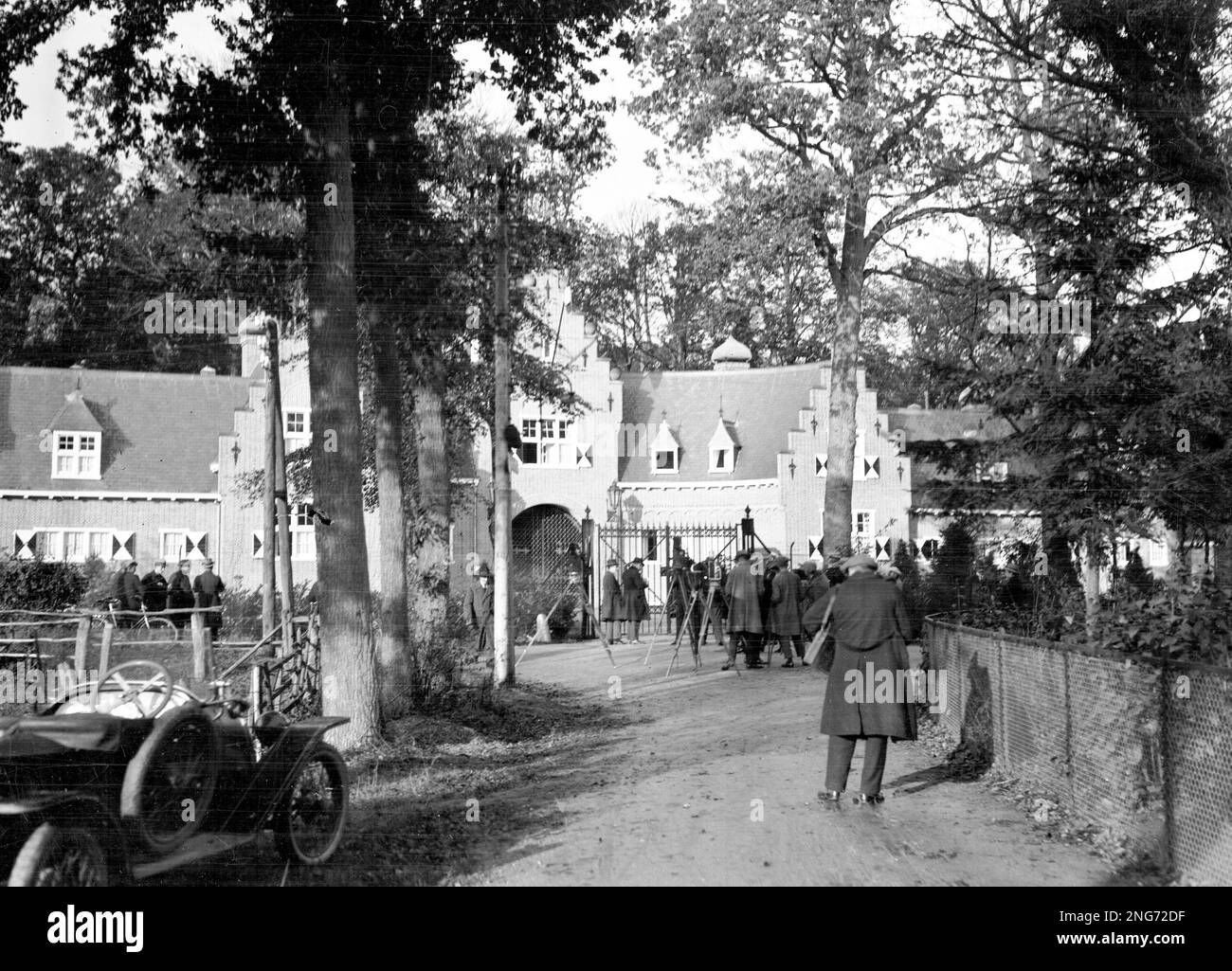National and international press gather outside the Lodge House of ...