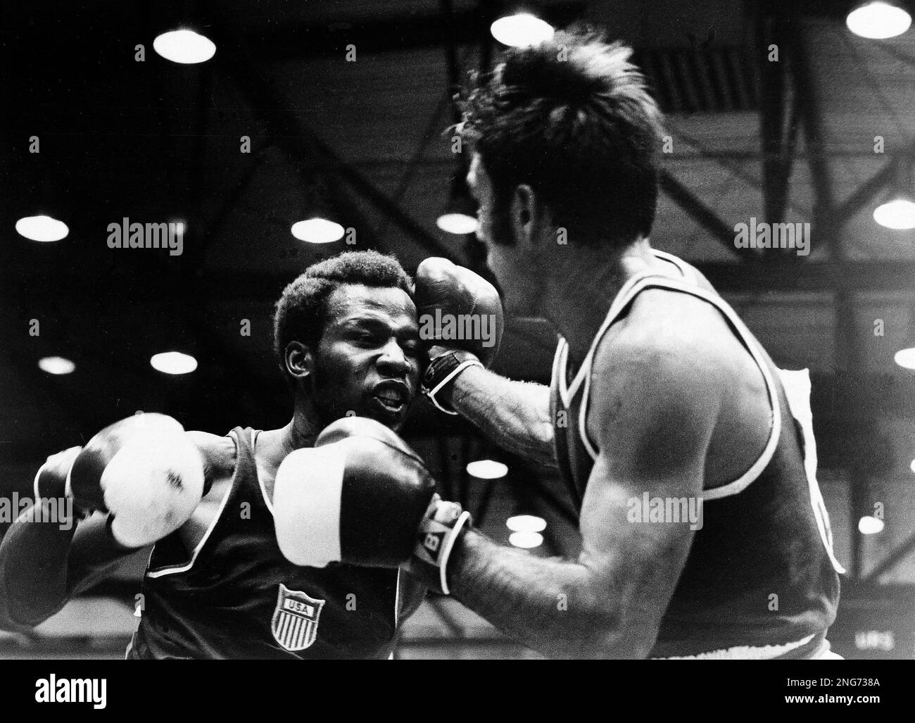 American boxer Reggie Jones, left, gets a punch from Soviet Union's ...