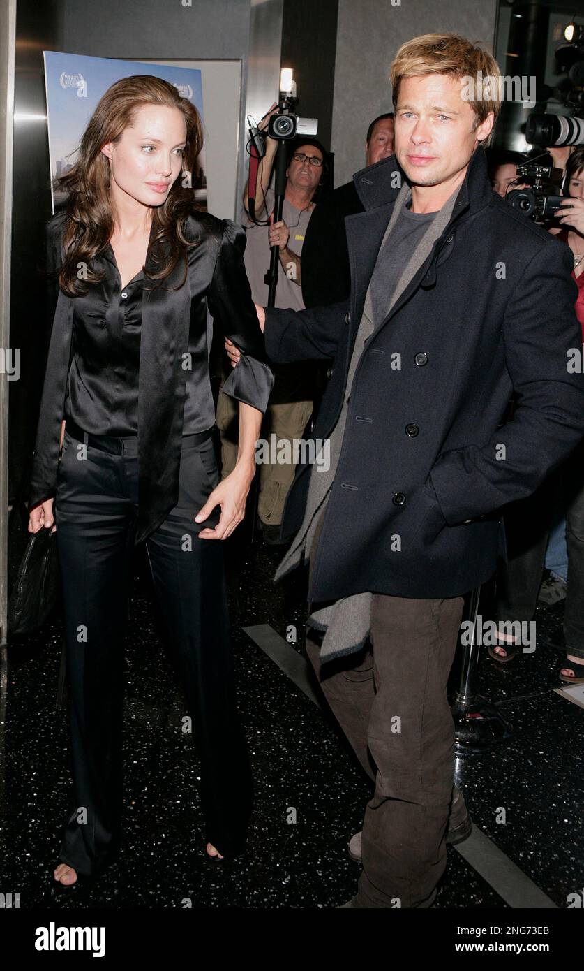 Actress Angelina Jolie, left, and actor Brad Pitt arrive at the ...