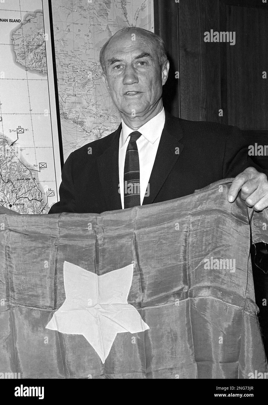 Sen. Strom Thurmond (R-South Carolina) displays a Viet Cong flag, a ...