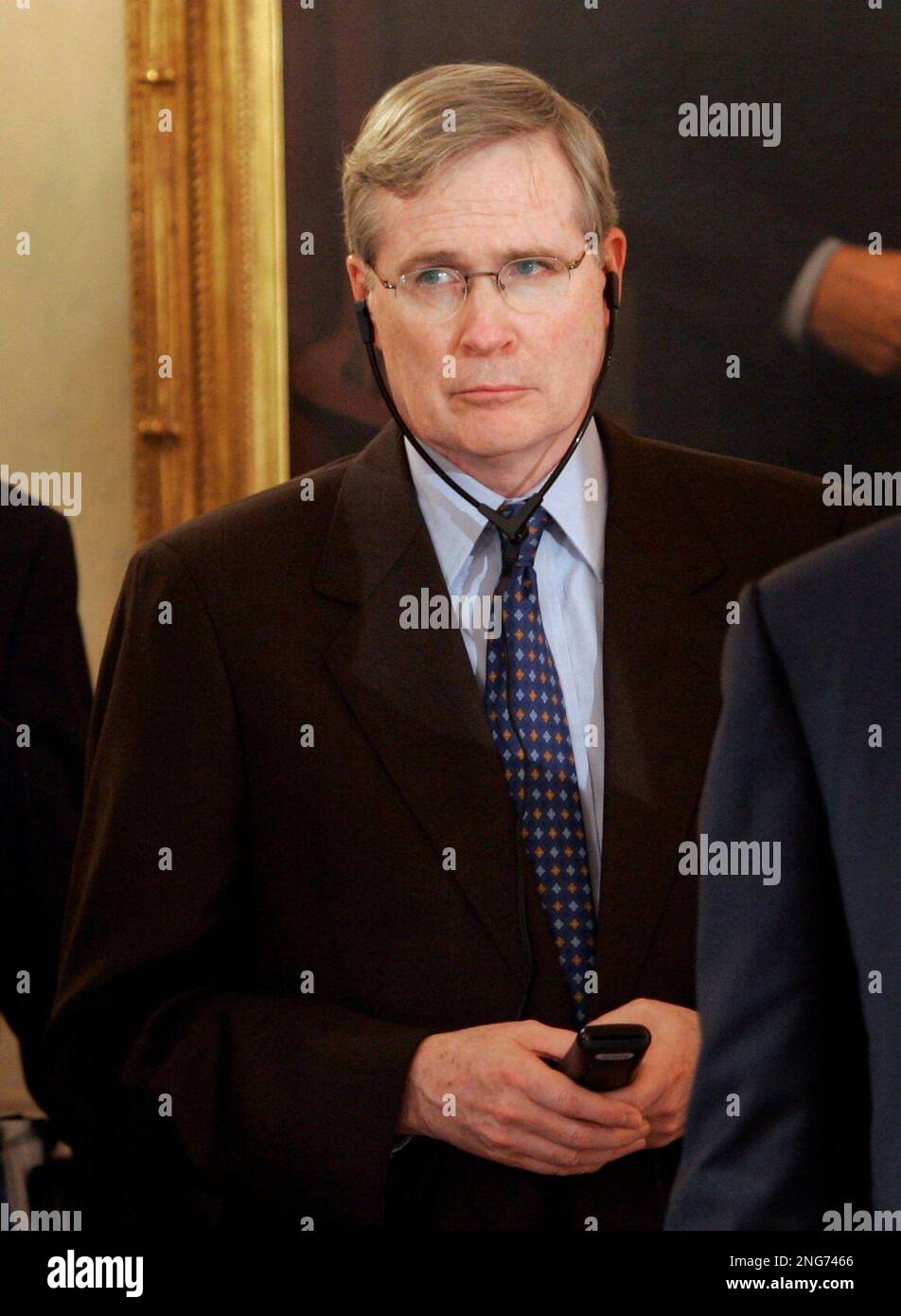 National Security Advisor Stephen Hadley listen to translations through ...