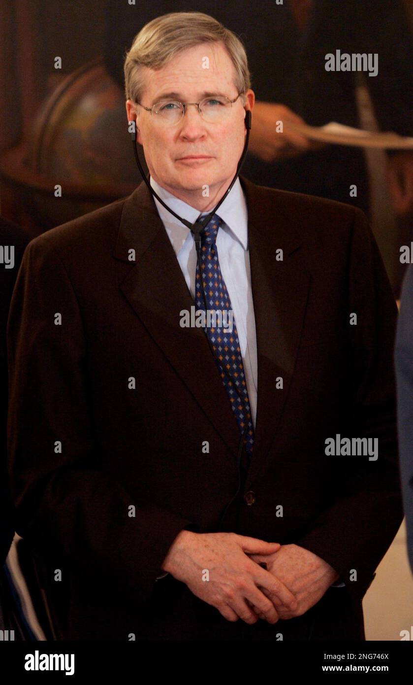 National Security Advisor Stephen Hadley listen to translations through ...