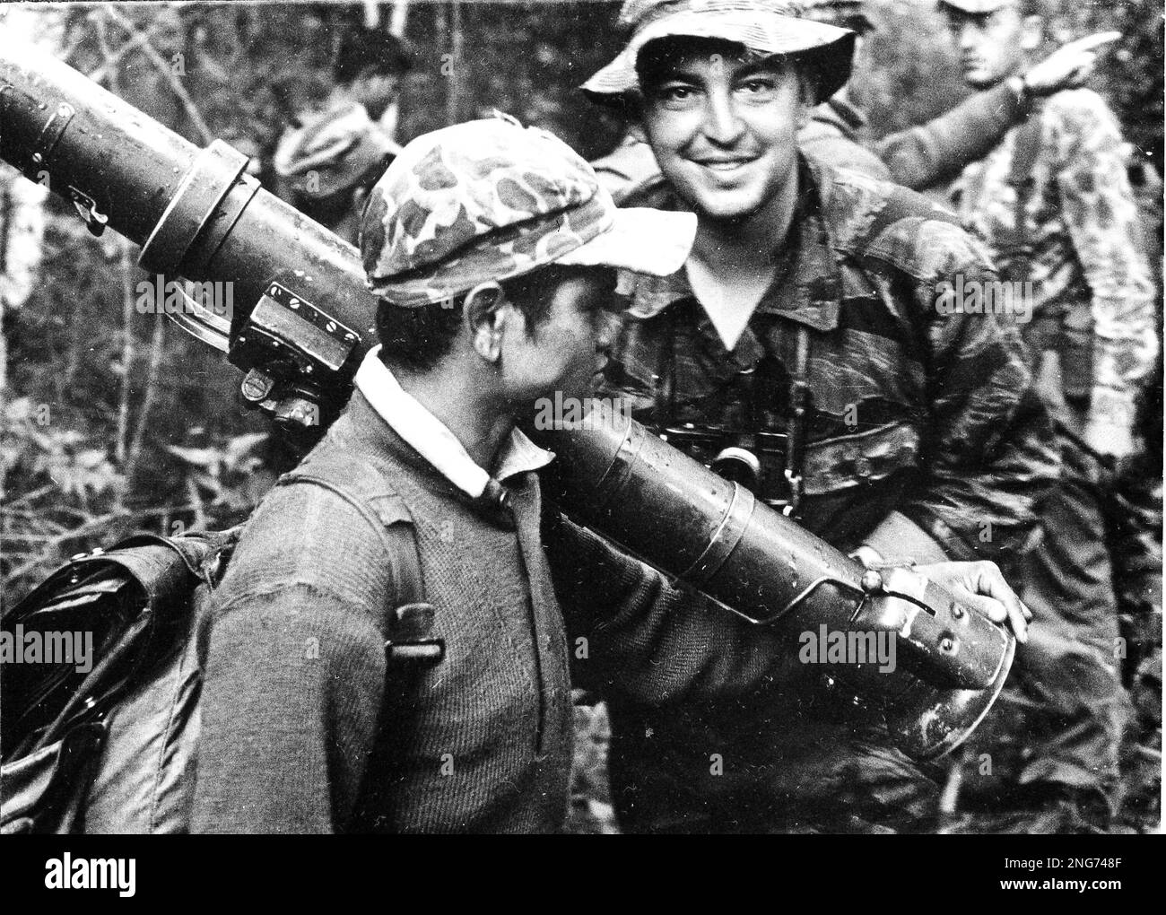 AP photographer Horst Faas, facing camera, is pictured in a jungle ...