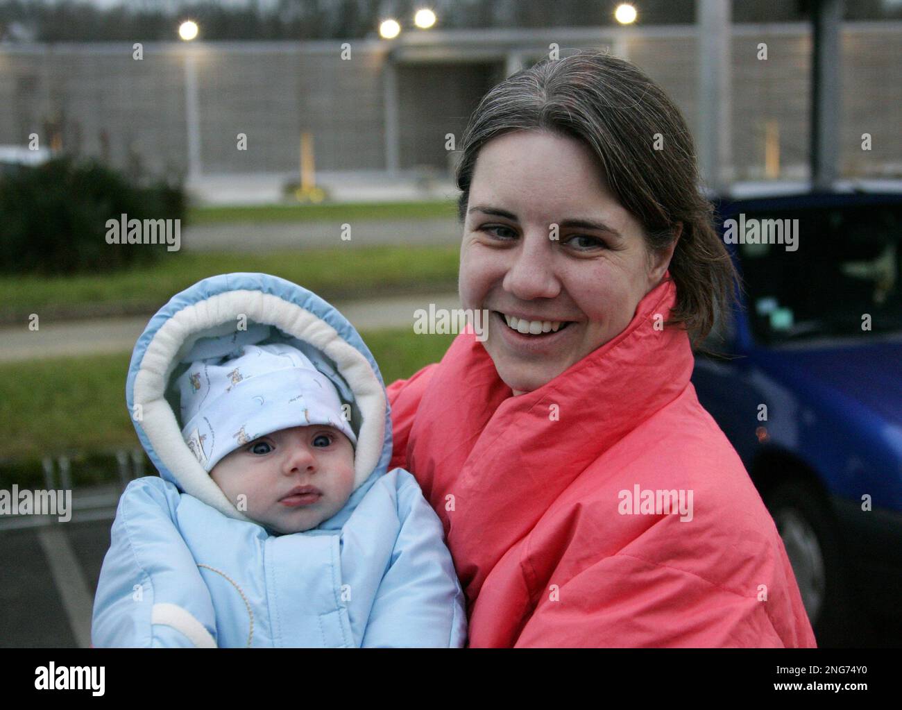 France's Nathalie Gettliffe, with her son Martin, arrives at the Fleury ...