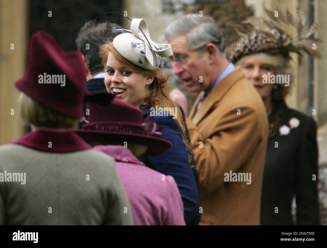 Britain's Princess Beatrice, center, looks towards her grandmother ...