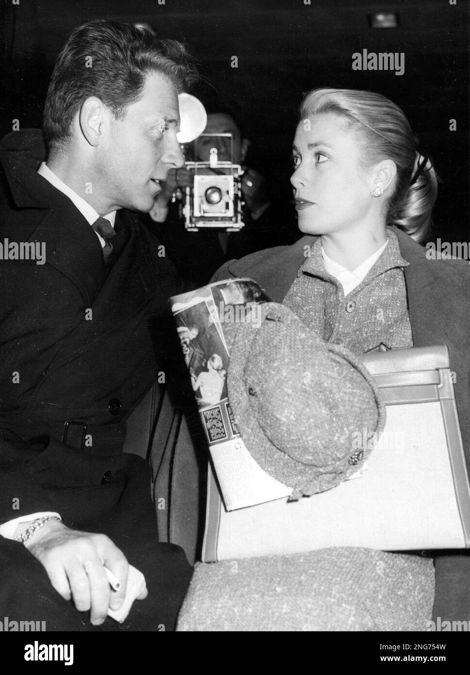 French actor Jean Pierre Aumont, left, sees Grace Kelly off as she ...
