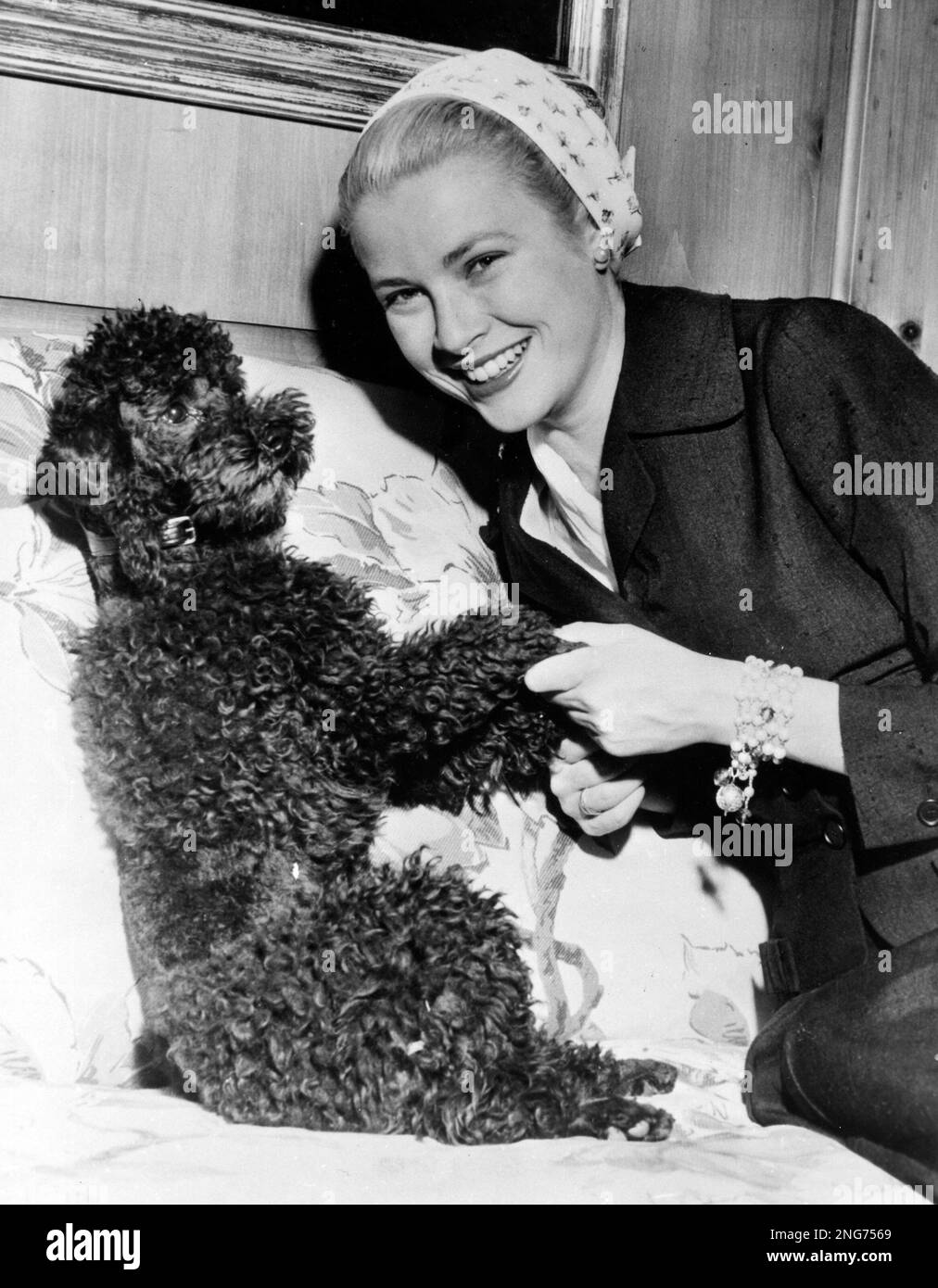 Grace Kelly with her pet poodle "Oliver" upon her return home from ...