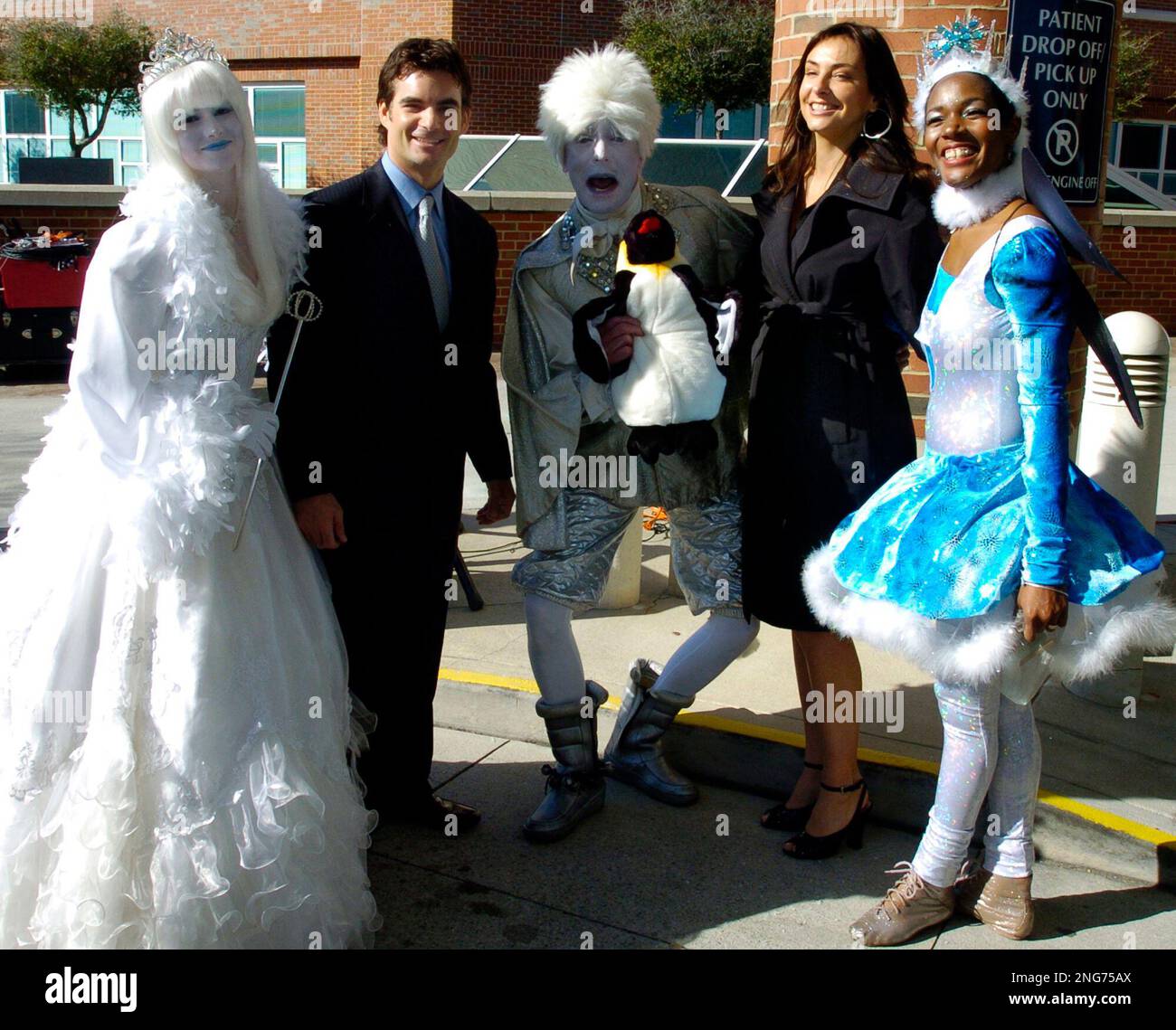 NASCAR driver Jeff Gordon and his wife Ingrid pose for photos with a ...