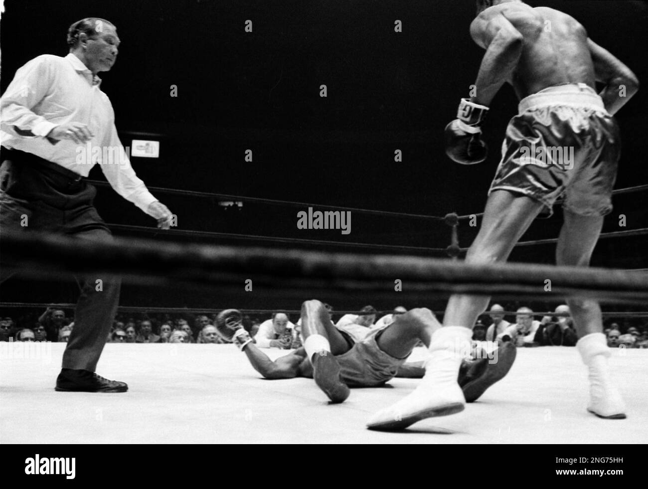 Bob Foster stands over Dick Tiger after Foster connected with a left ...