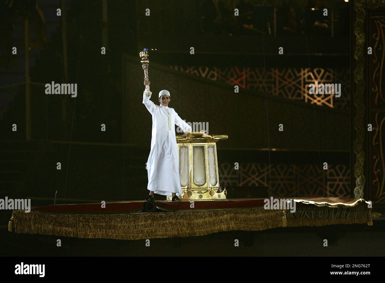 A young performer rides a 'magic carpet' during the Closing Ceremony of ...