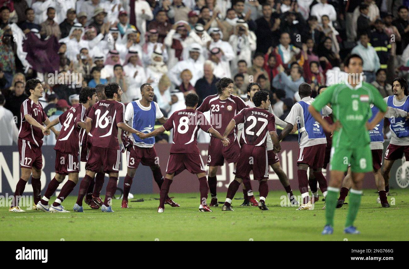 Qatar soccer players react after beating Iraq 1-0 to win the gold medal ...