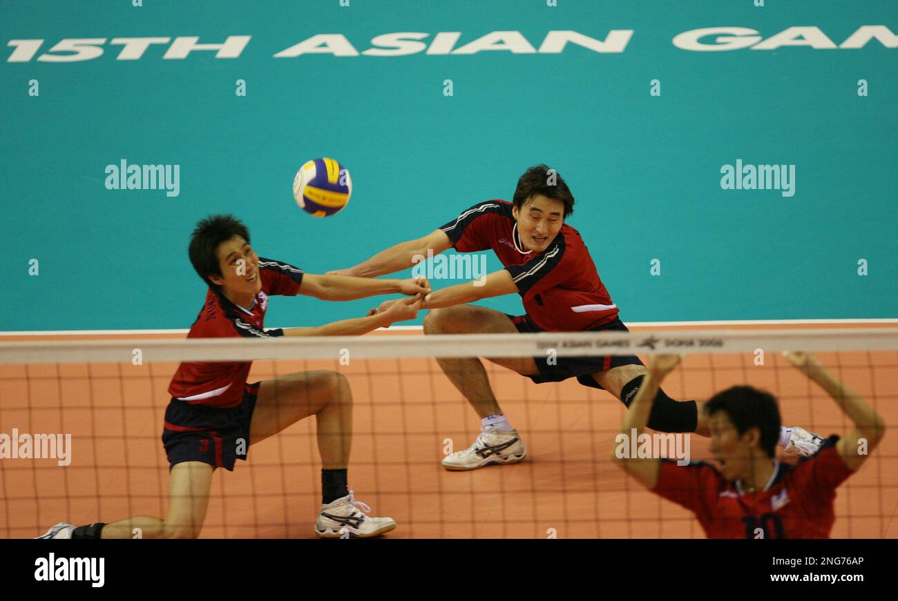 South Korean players receie a spike from China during the Asian Games ...