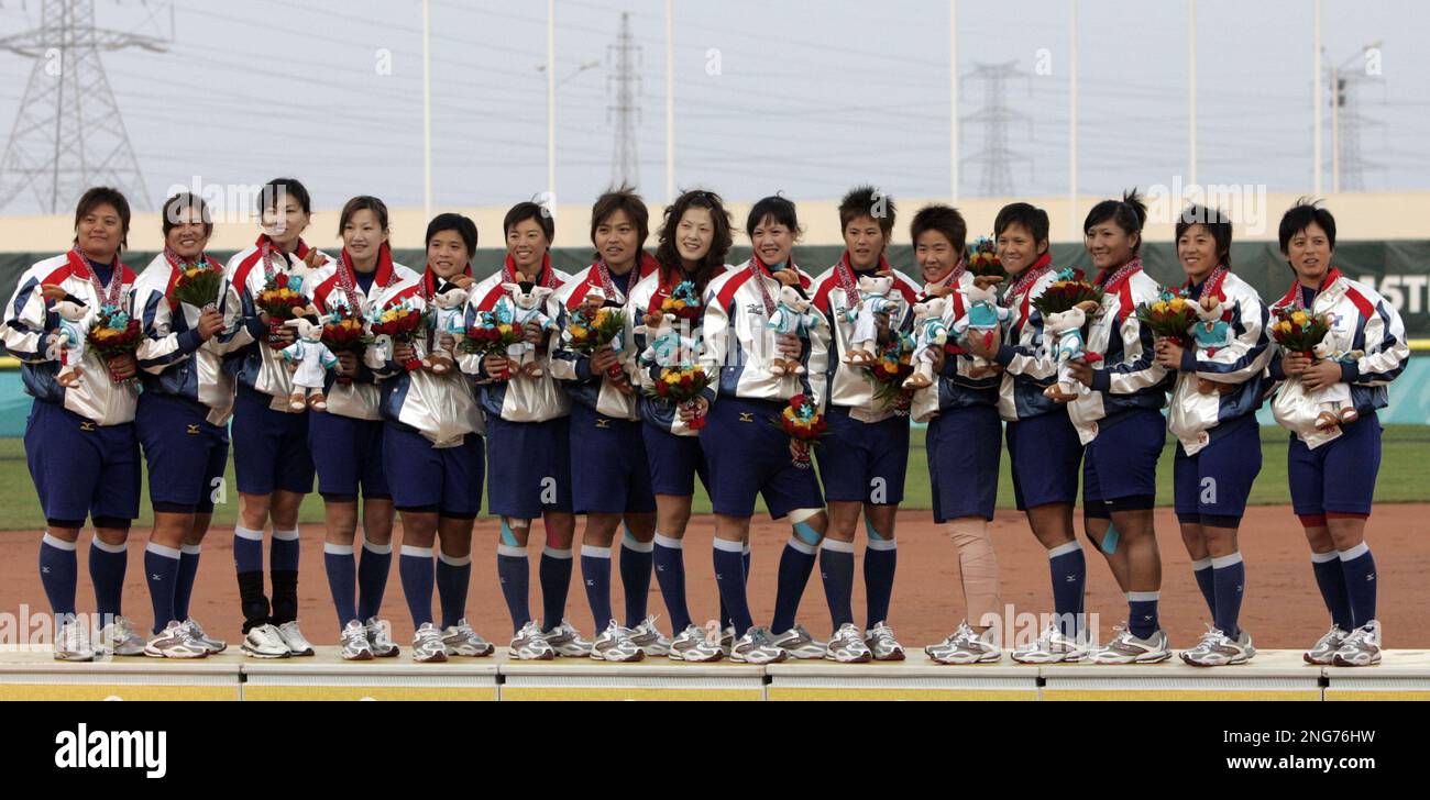 Taiwanese softball team members celebrate their silver medal victory on ...
