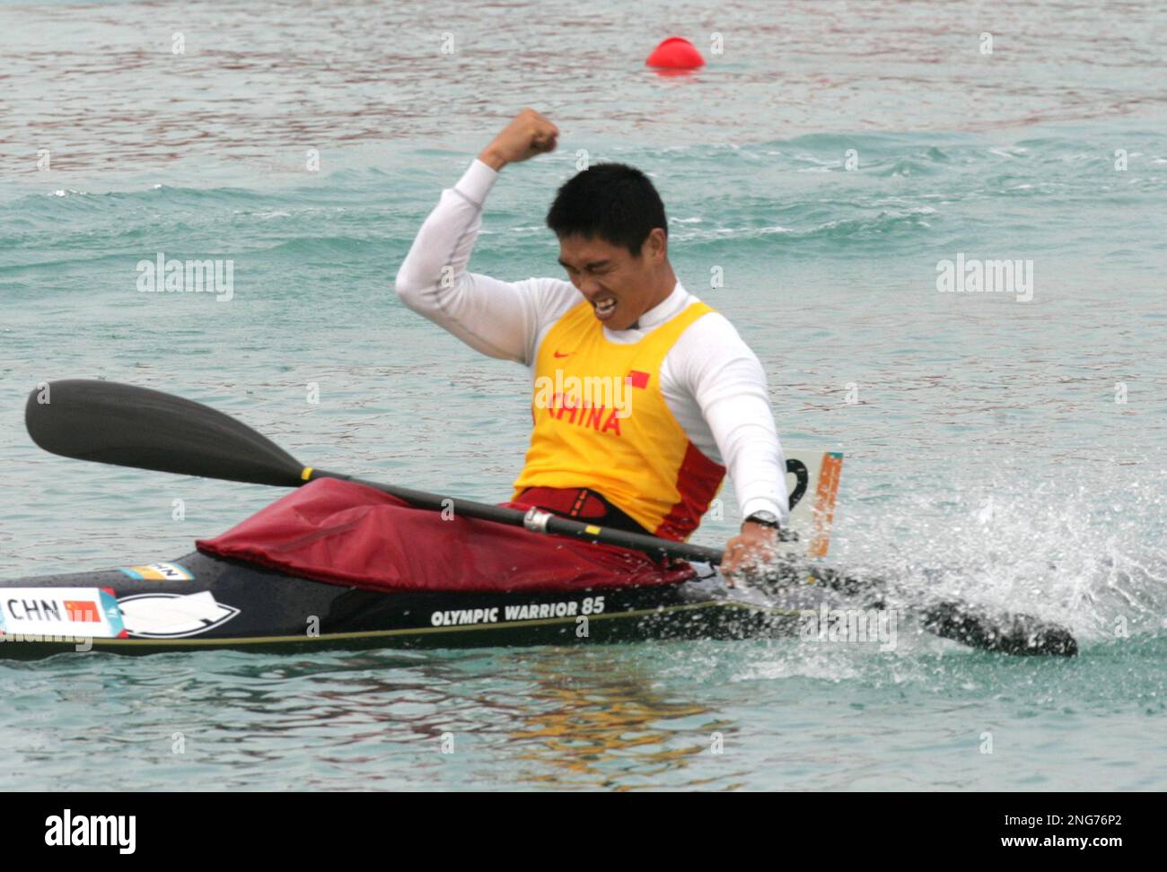 China's Liu Haitao celebrates his victory after crossing the finish ...