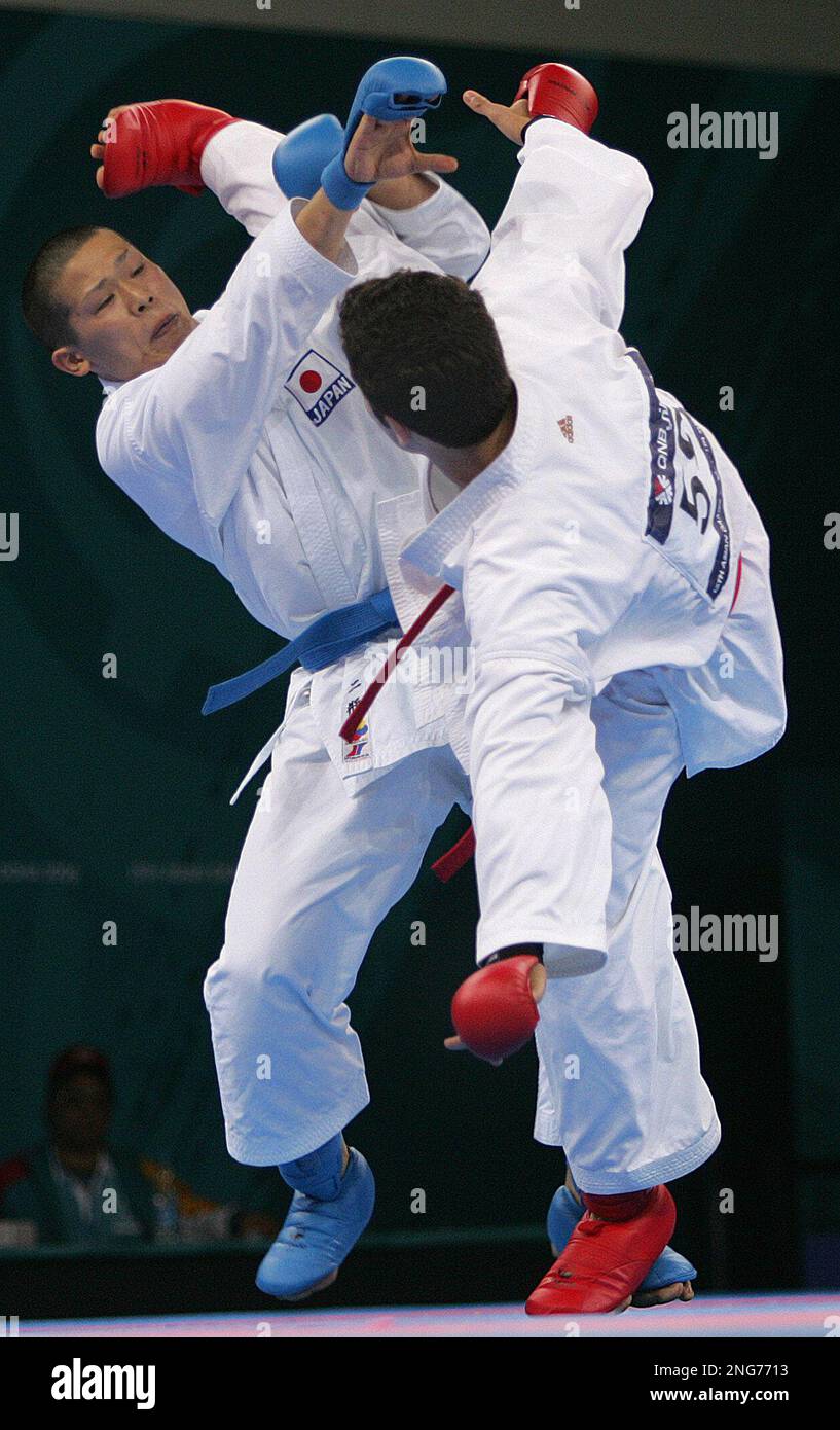 Japan's Takuro Nihei, left, and Lebanon's Ali Younes clash in their Men ...