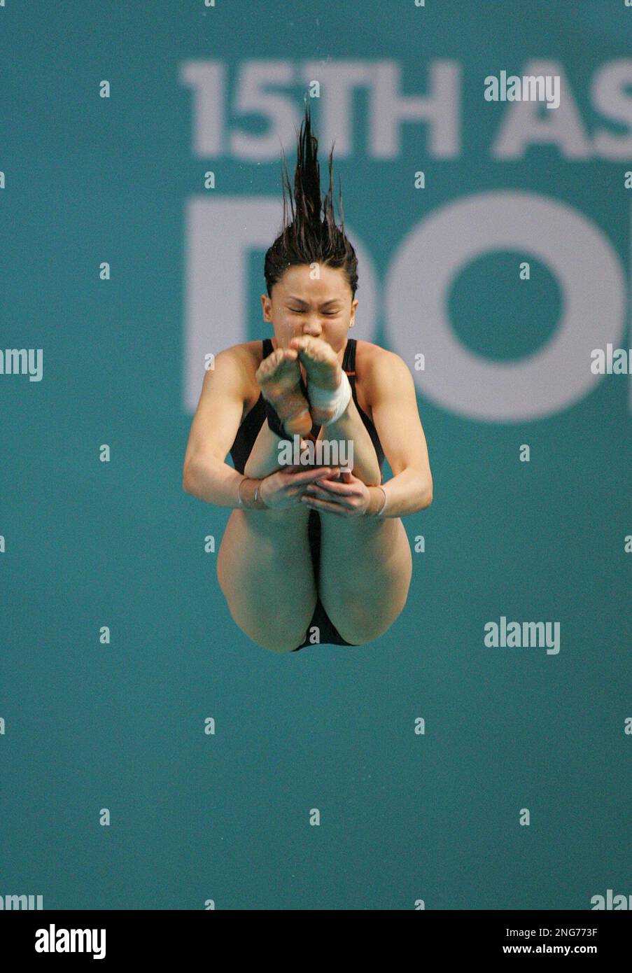 Malaysia's Leong Mun Yee dives at women's 3m springboard final in the Asian Games in Doha, Qatar ...