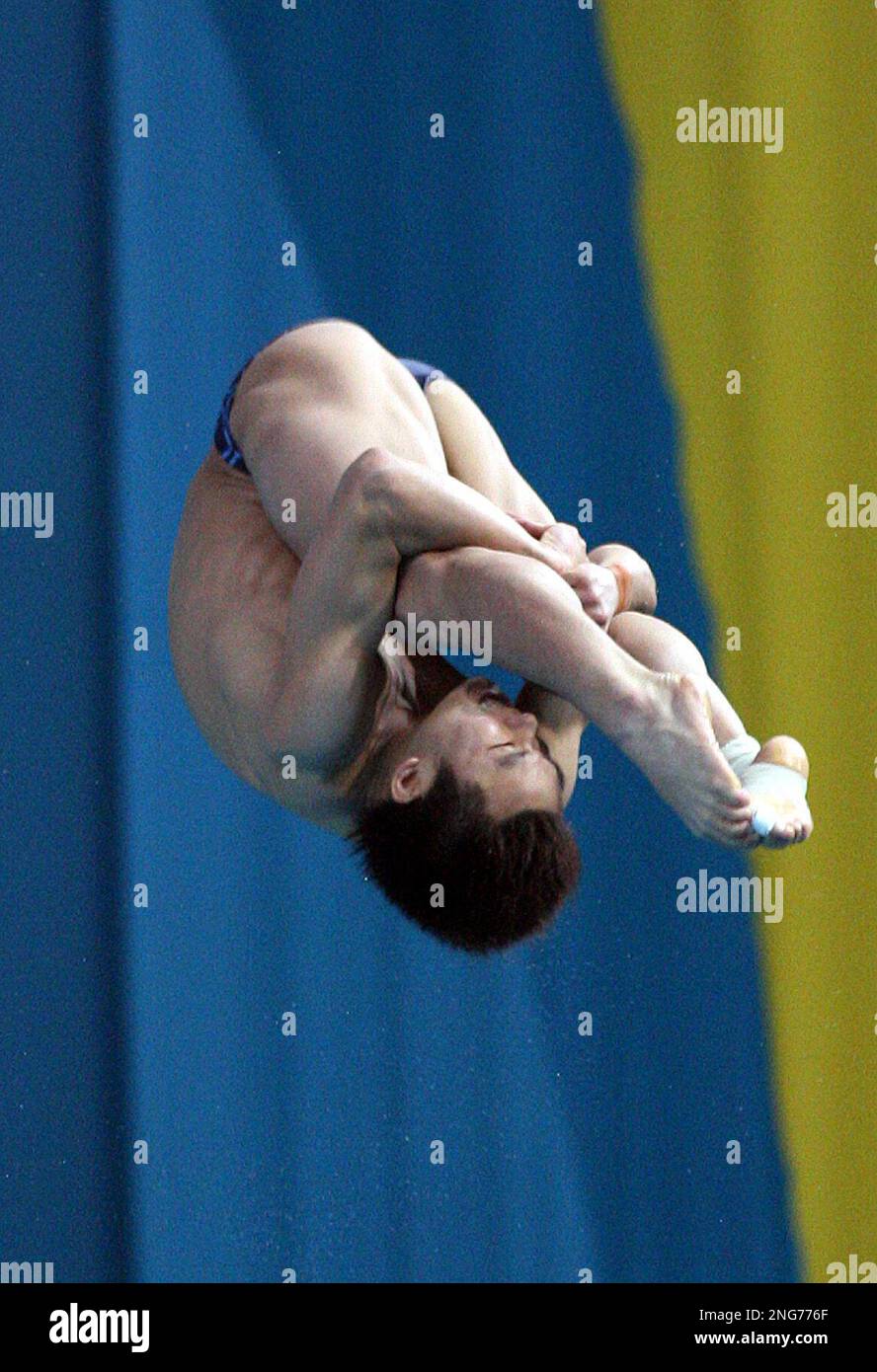 China's Luo Yutong dives at men's 3m springboard final in the Asian ...