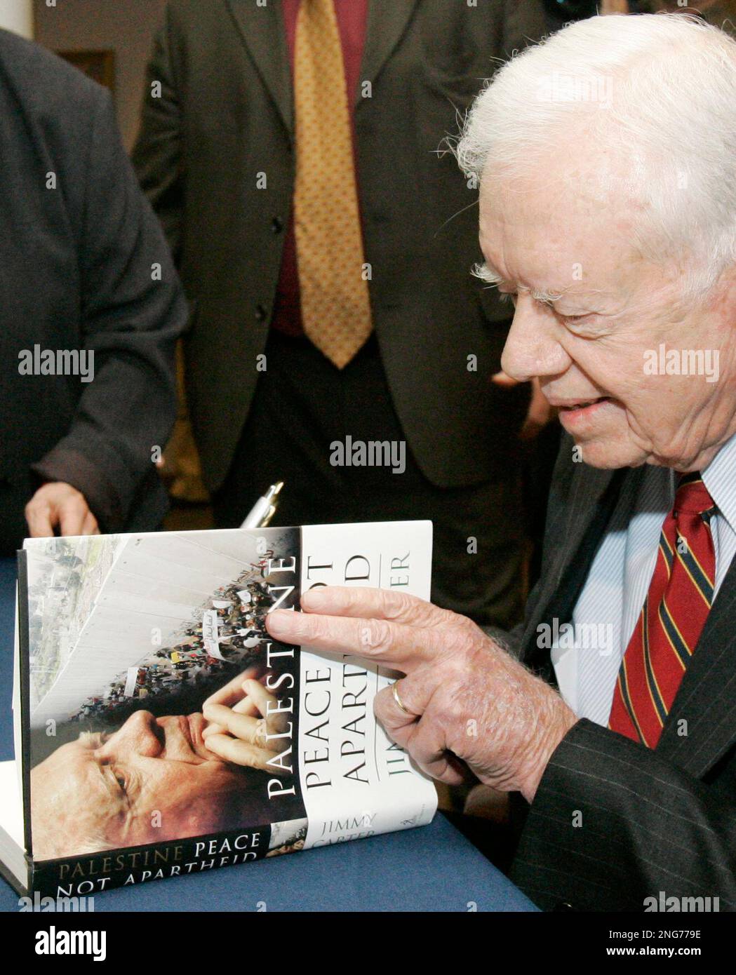 Former President Jimmy Carter signs copies of his book "Palestine ...