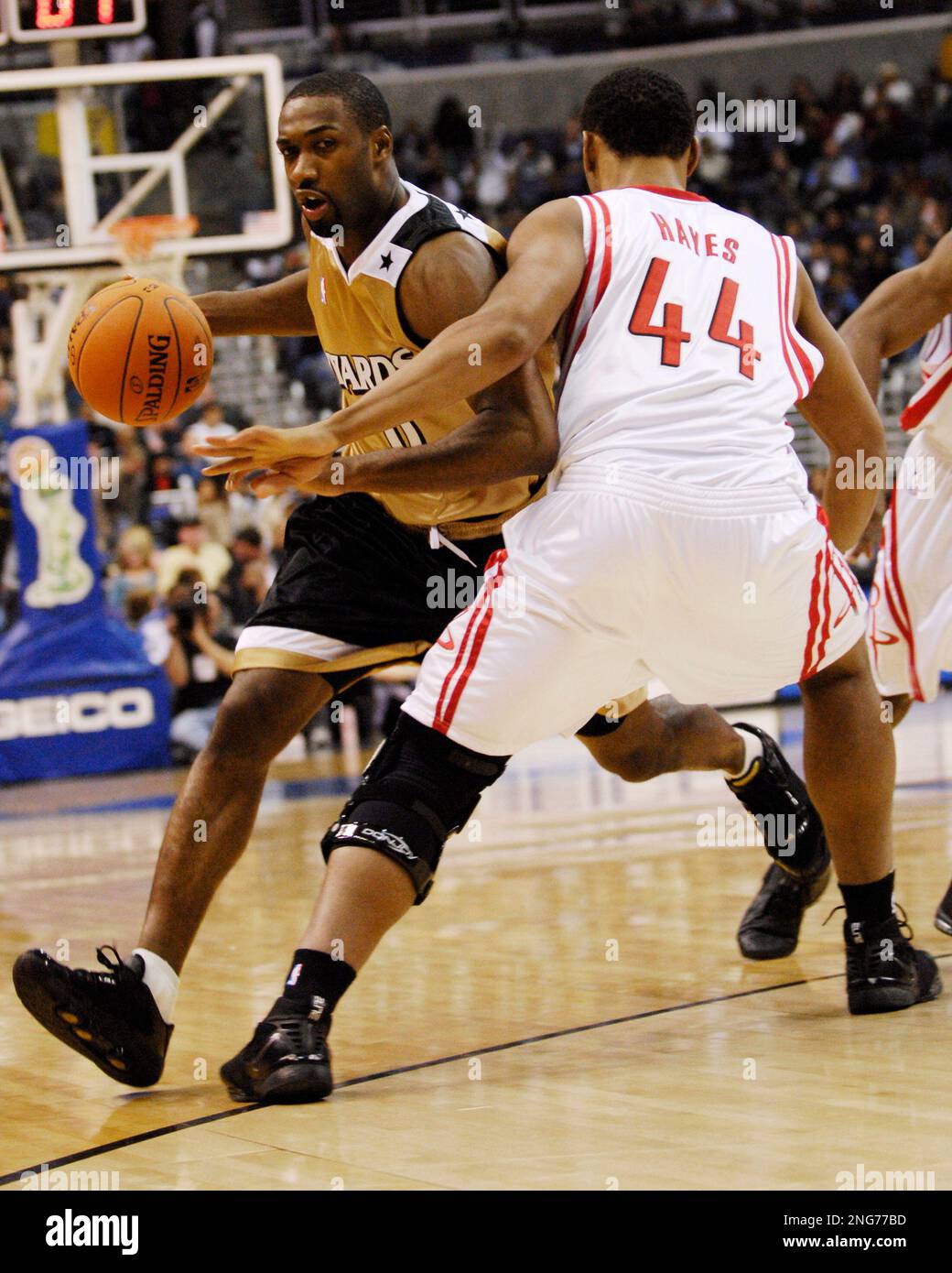 Washington Wizards' Gilbert Arenas (0) dribbles around Houston Rockets ...