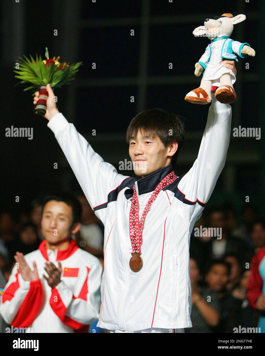South Korea's Hong Moo-won celebrates after receiving the bronze medal ...